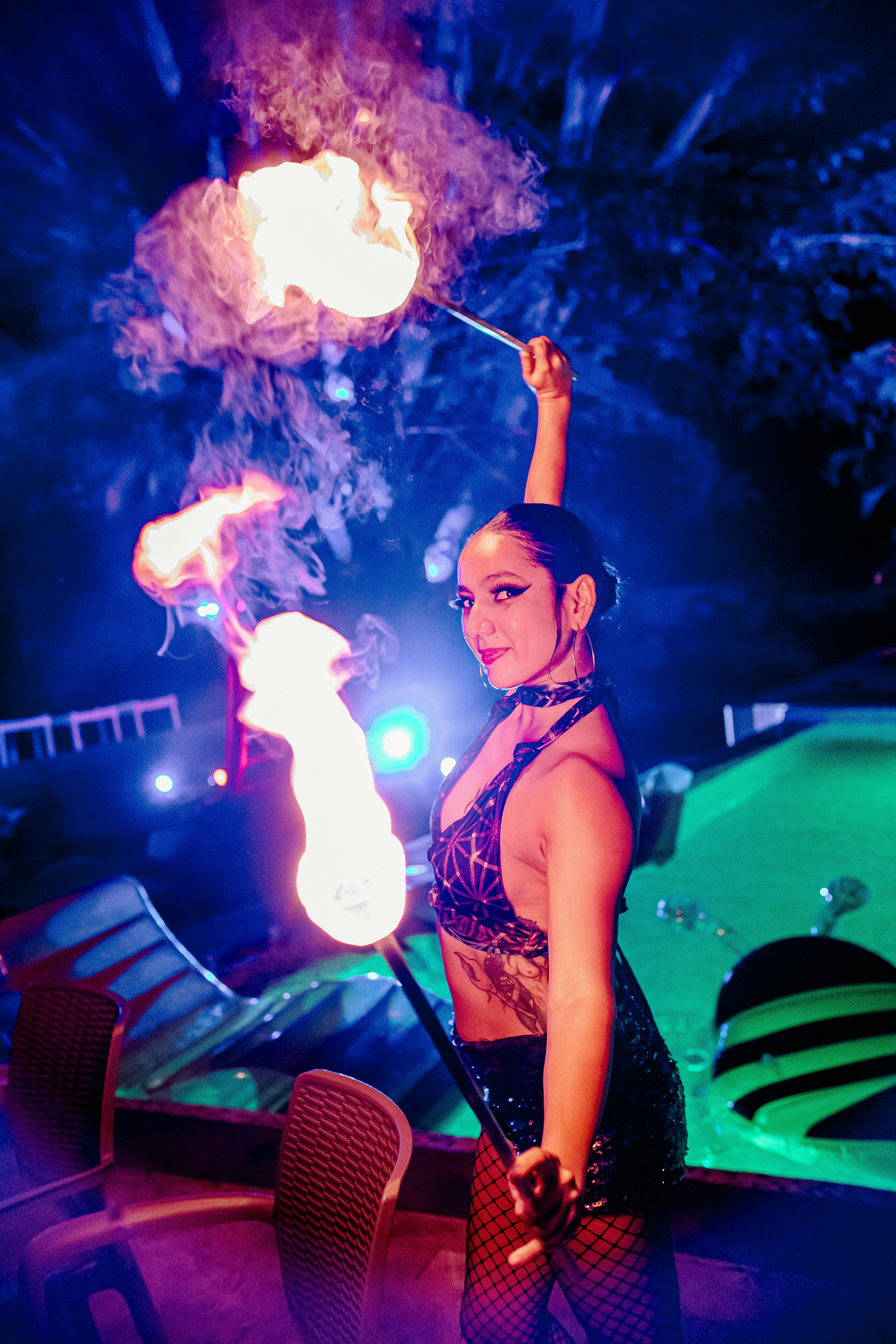 Flames Over the Night: A Dancer Commands Fire at Cobalt Hour