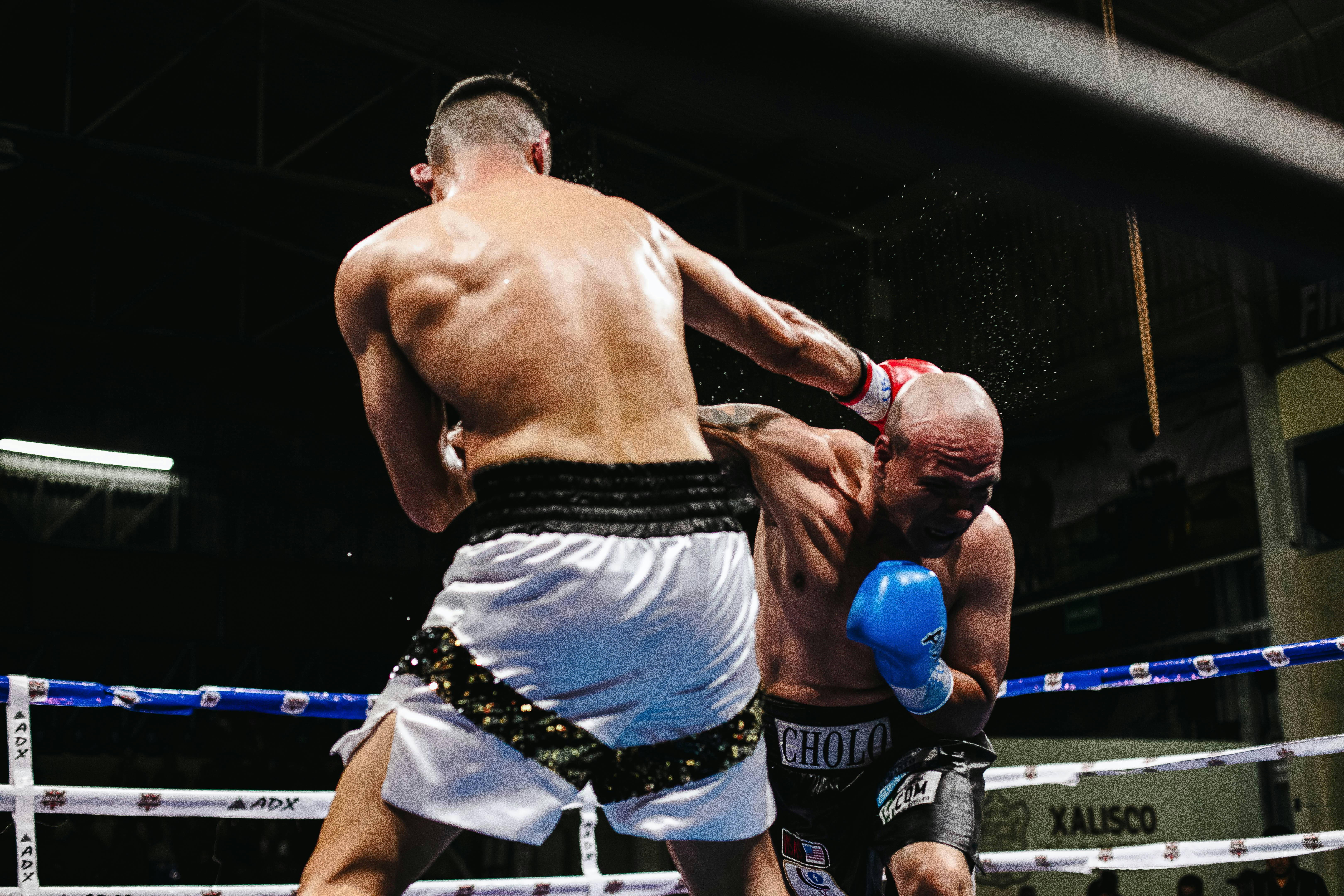 Impact in the Ring: A Muscular Clash Between Opponents