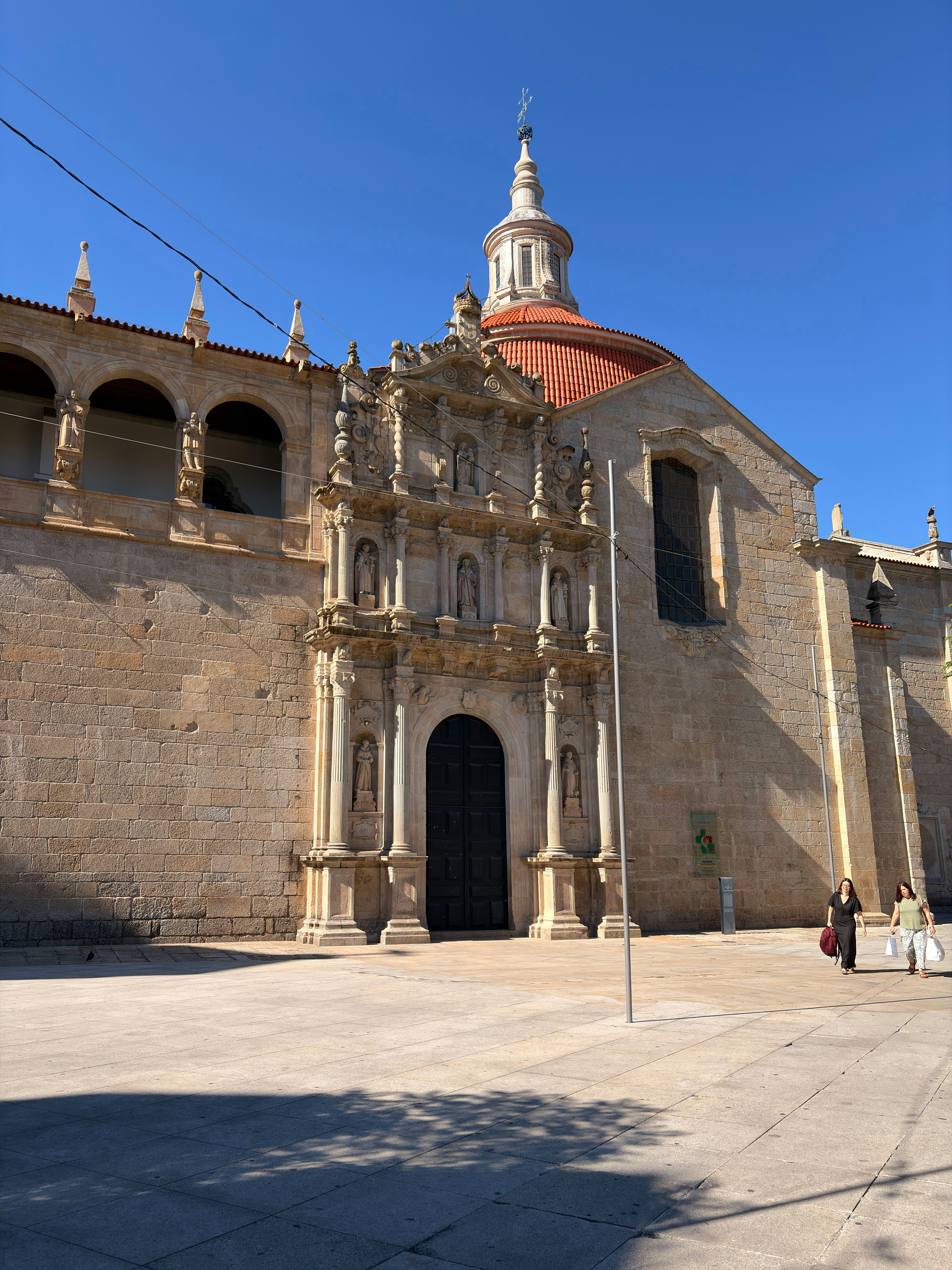 Sunlit Facade of a Historic Cathedral Gate