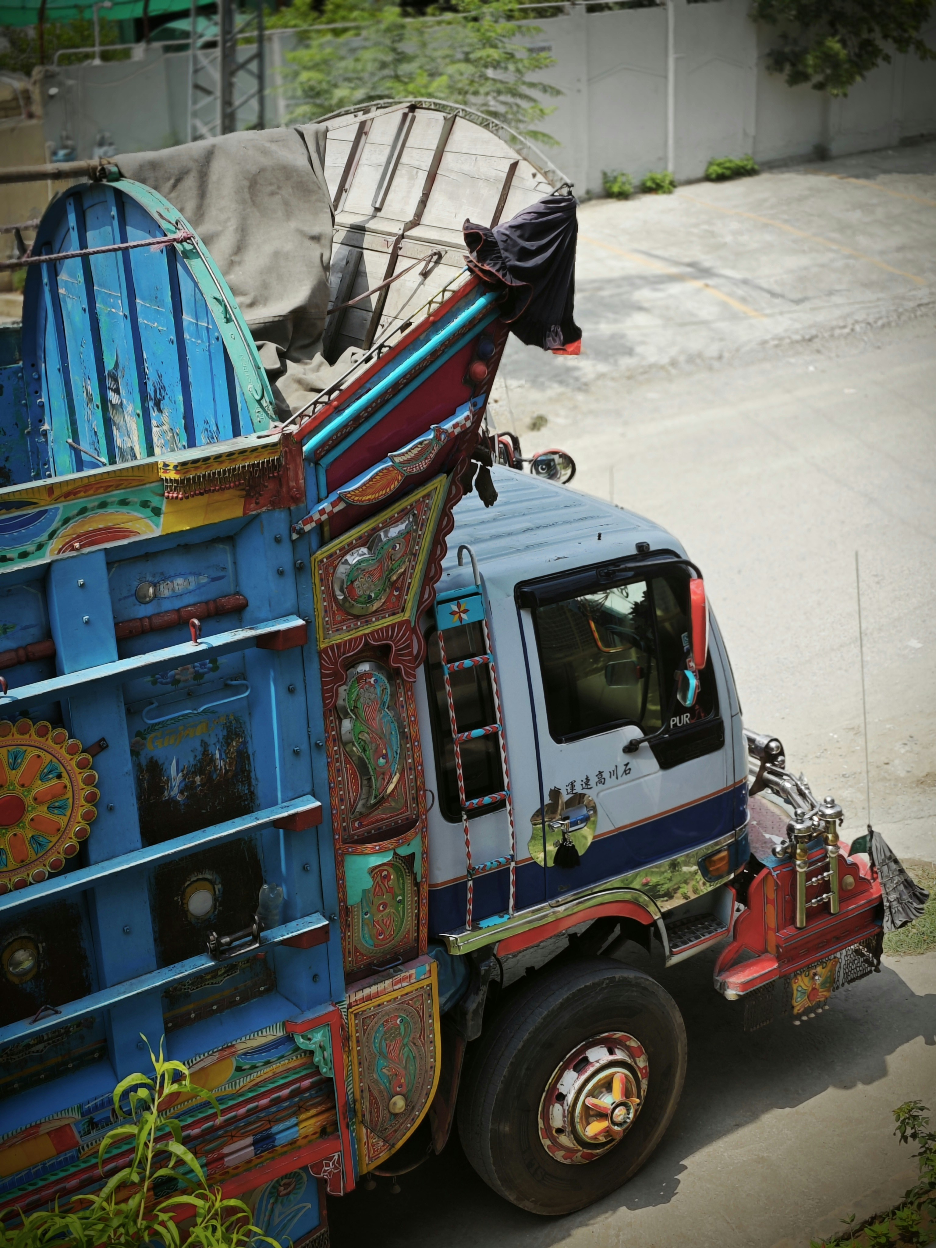 Colorful Truck Carriage: A Vibrant Street Scene from Above