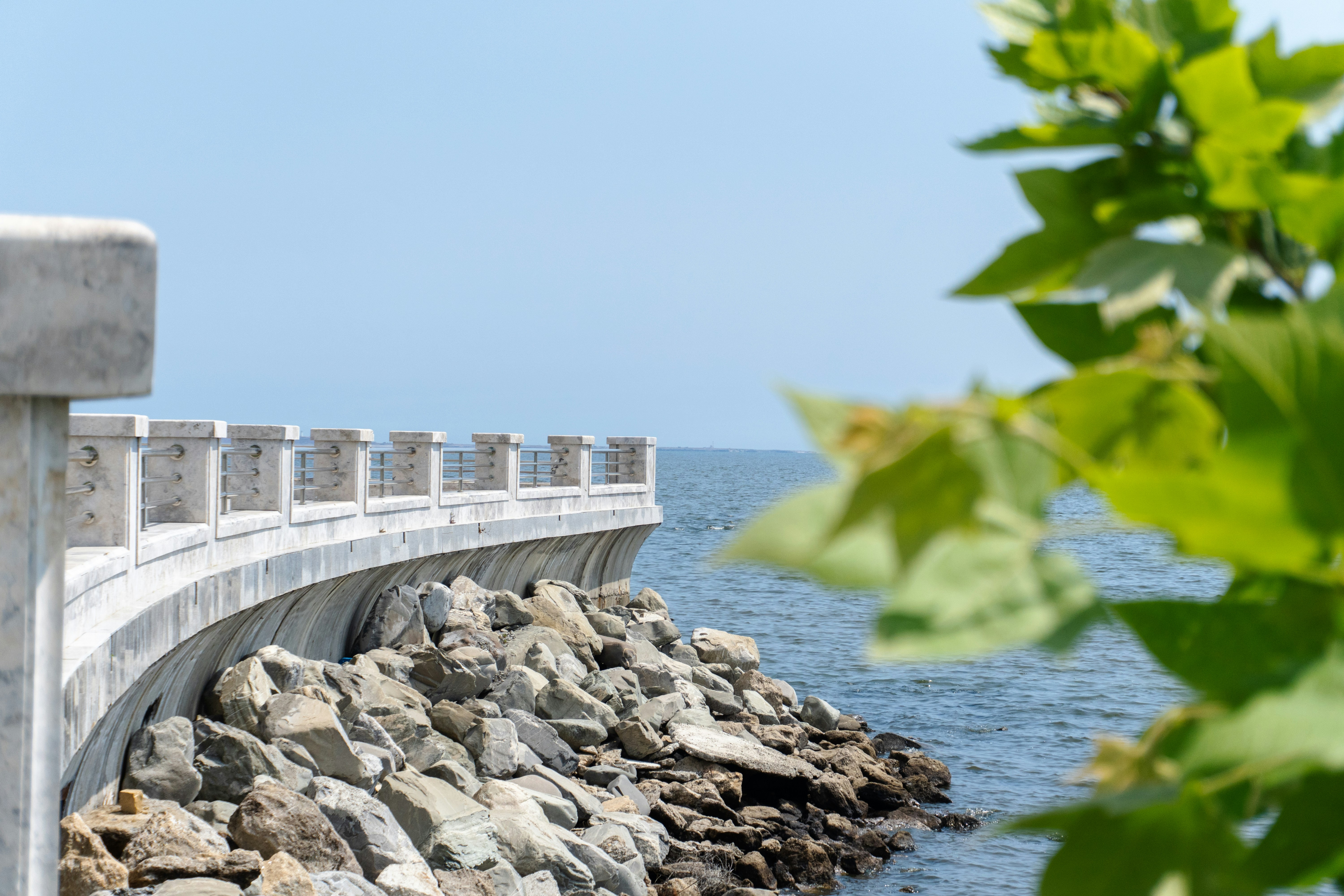 Curved Sea Wall Framing the Quiet Ocean