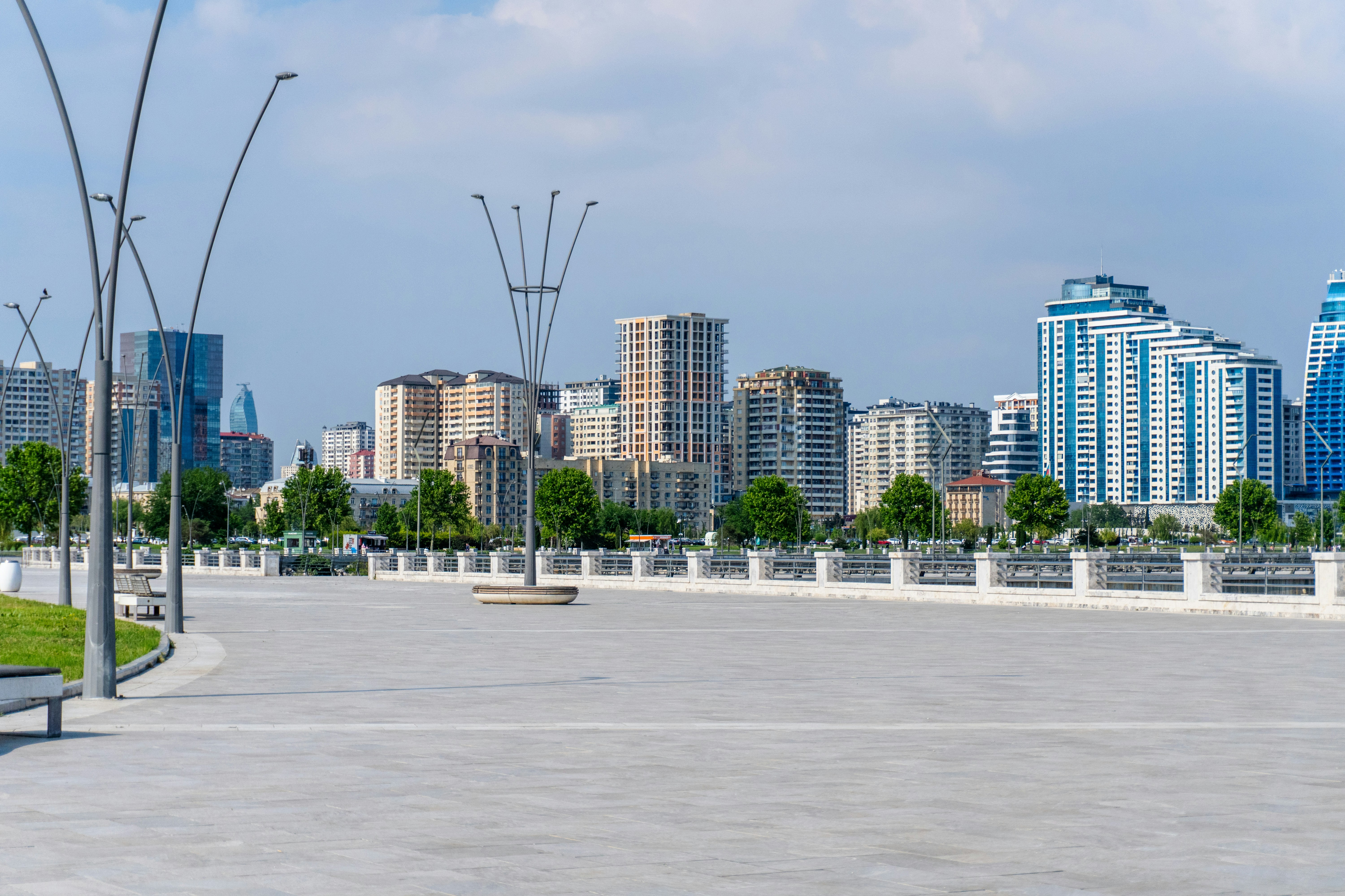 Riverside Skyline: A Quiet Urban Promenade Beneath Modern High-Rises