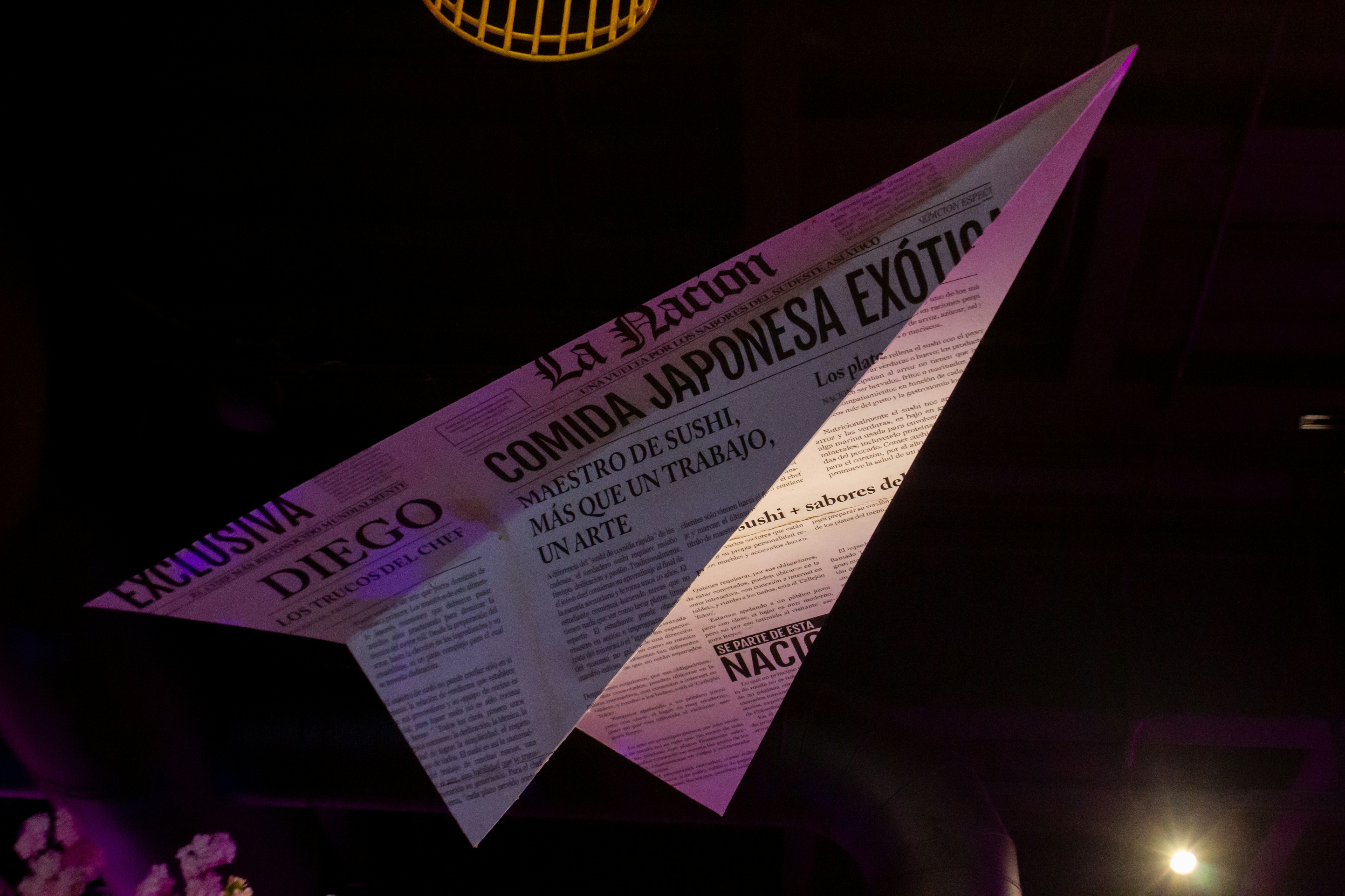 Cut-out of a newspaper kite: a dramatic suspended fragment