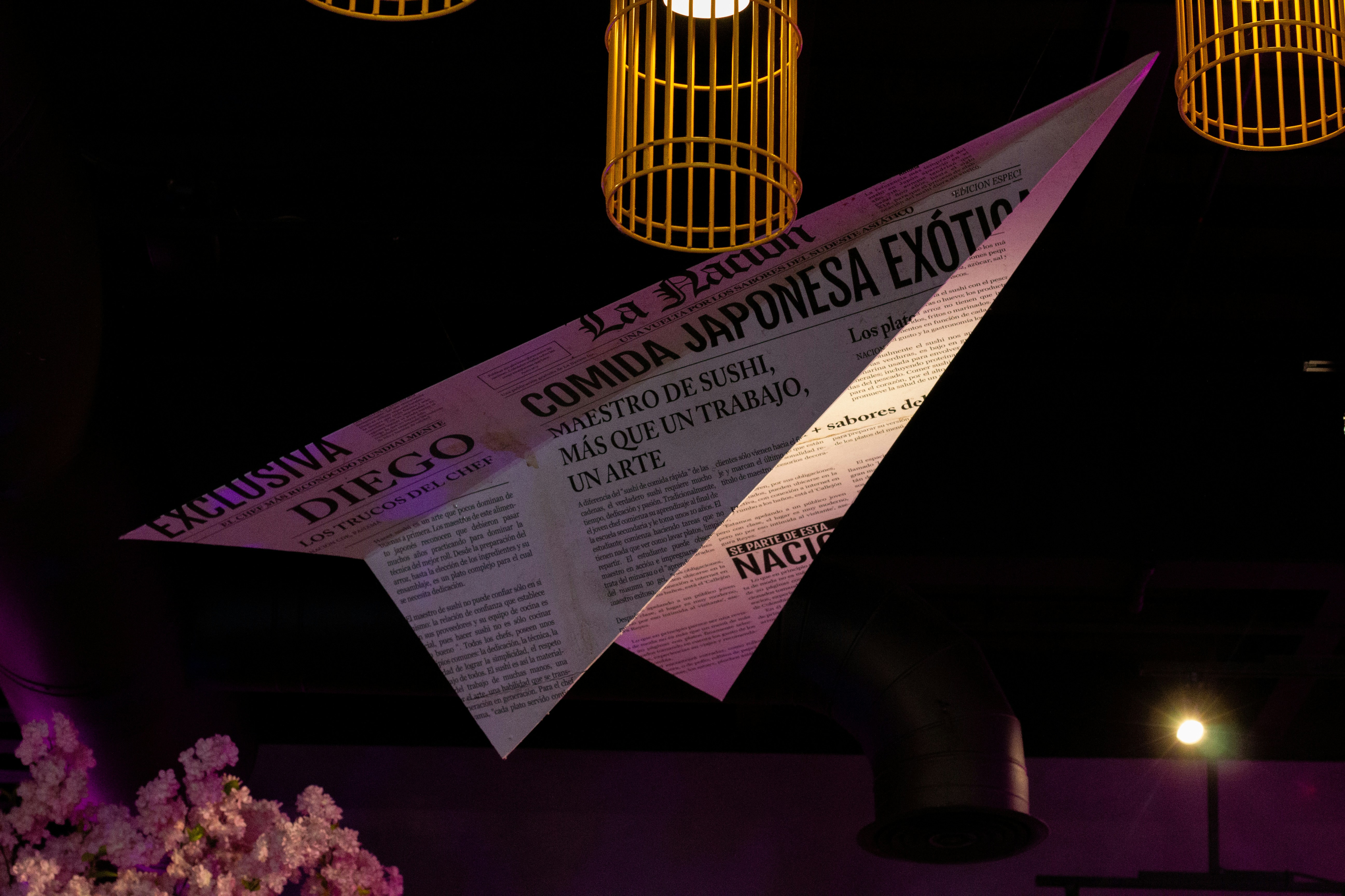 Paper Arrow Overhead: A Neon-Illuminated Origami of News