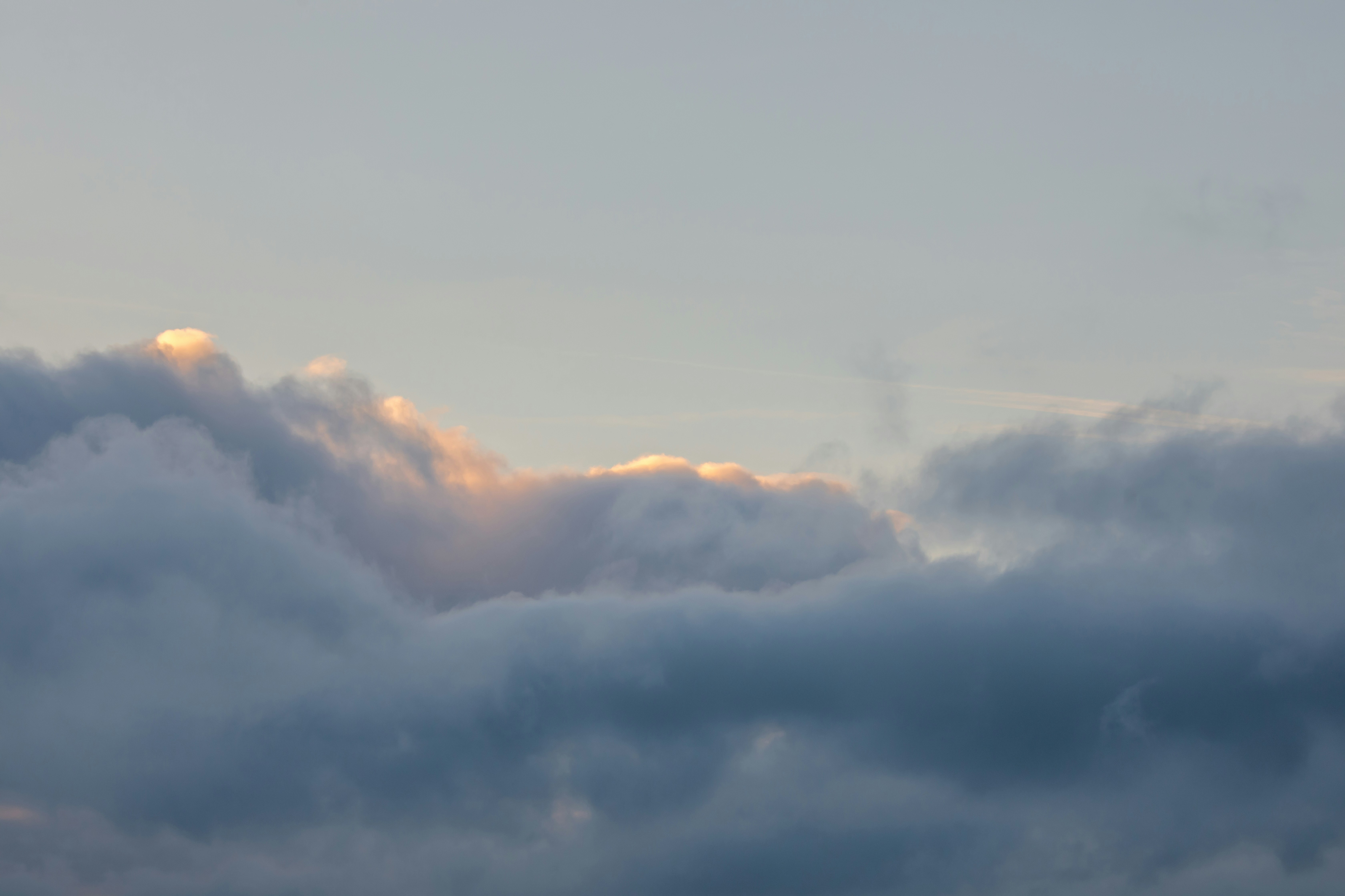 Soft Sunrise Clouds Over a Calm Horizon