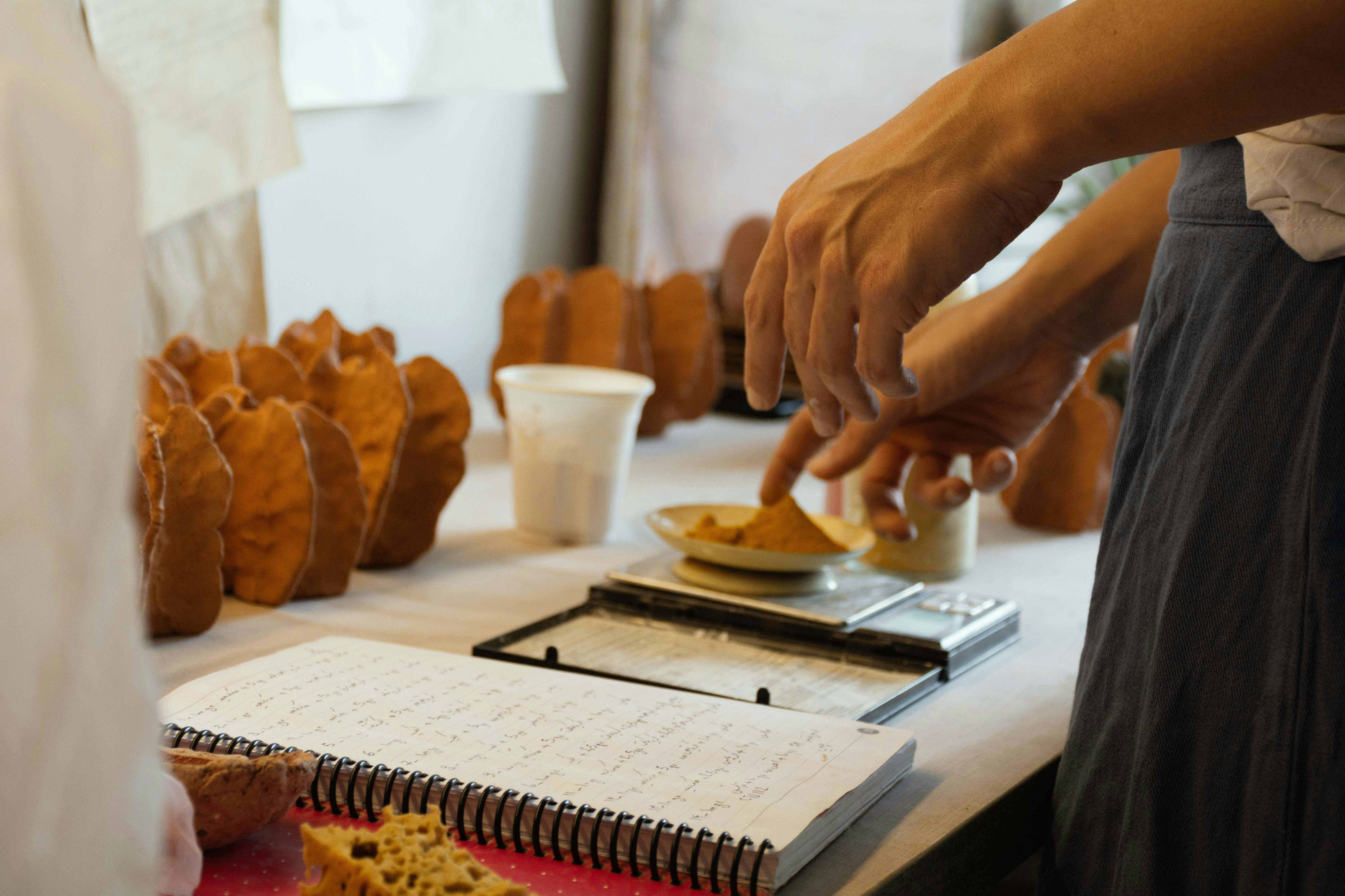 Hands at the Pastry Table: Measuring Icing and Shapes
