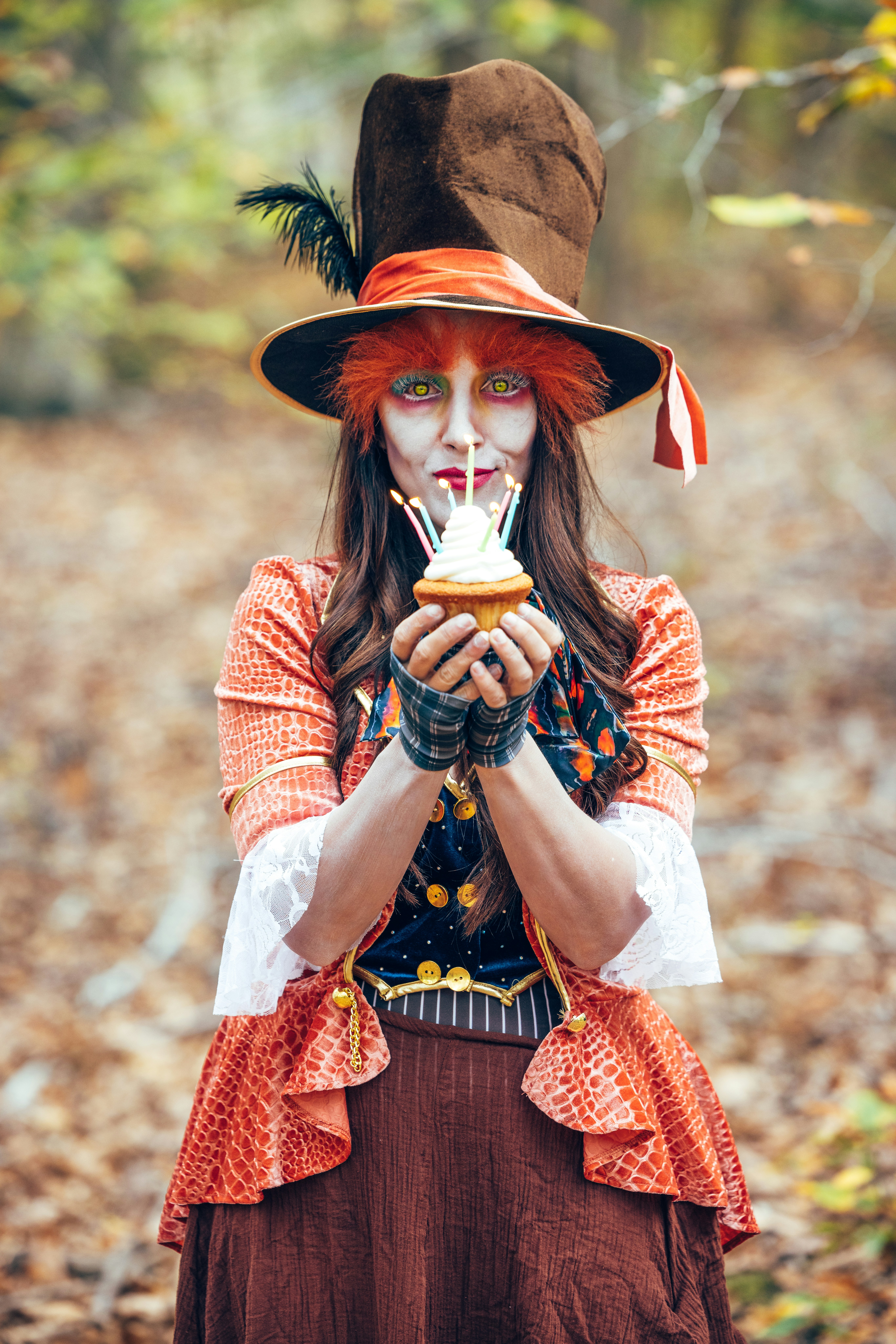 Whimsical Cupcake Moment Under a Mad Hatter’s Hat