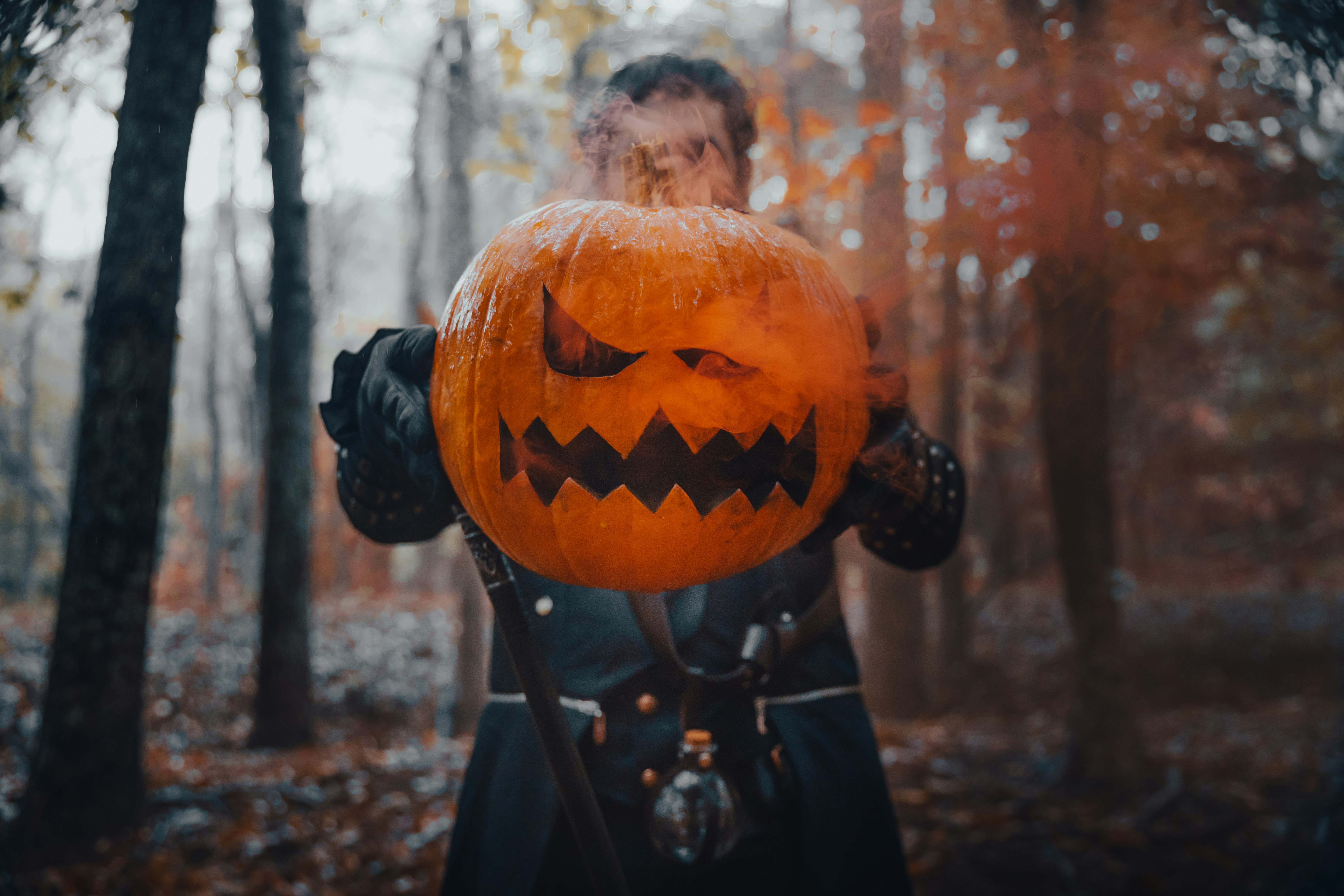 Jack-o’-lantern Reveal: A Halloween Moment in the Misty Woods