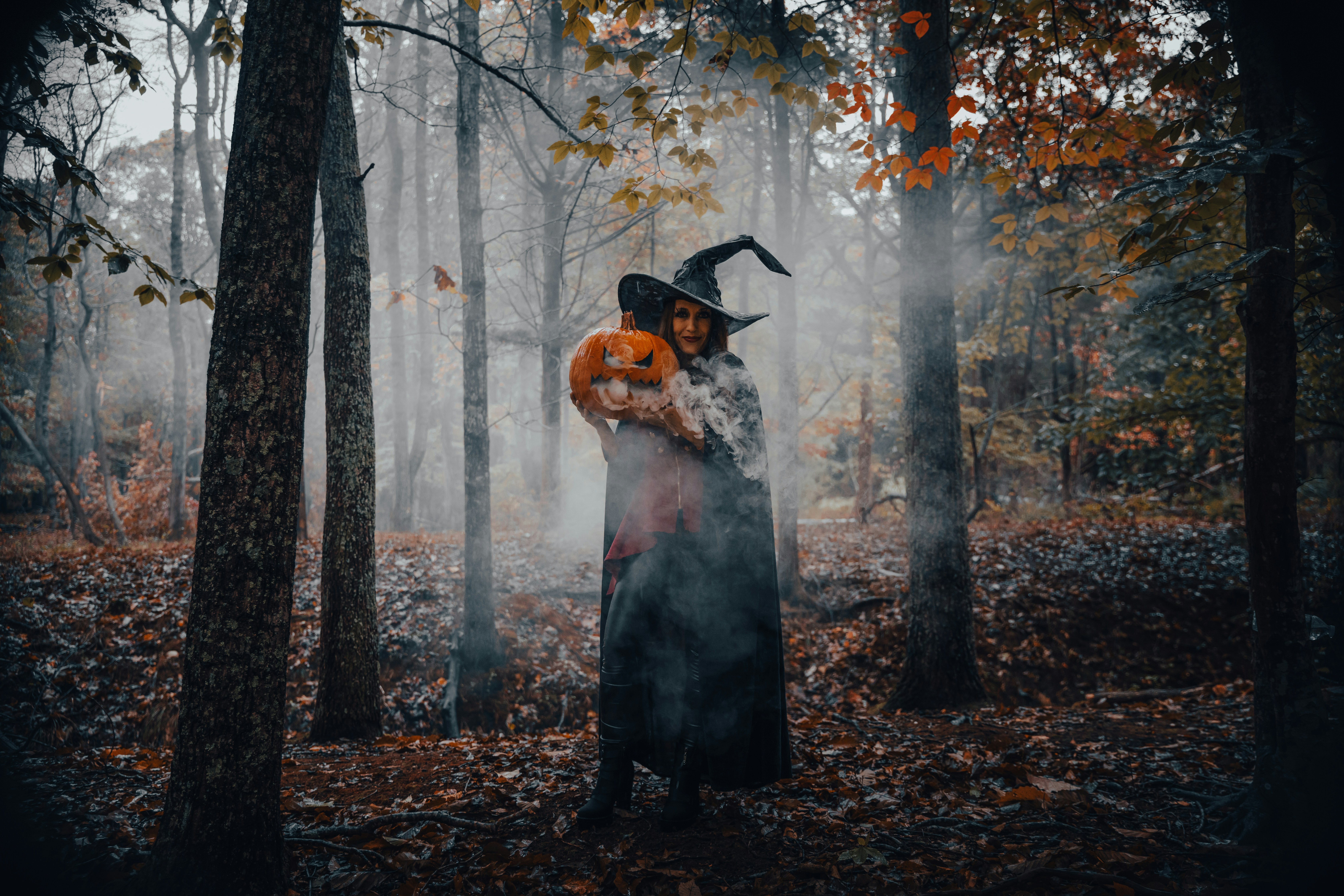Autumn Witch in the Mist: Embracing the Pumpkin Glow