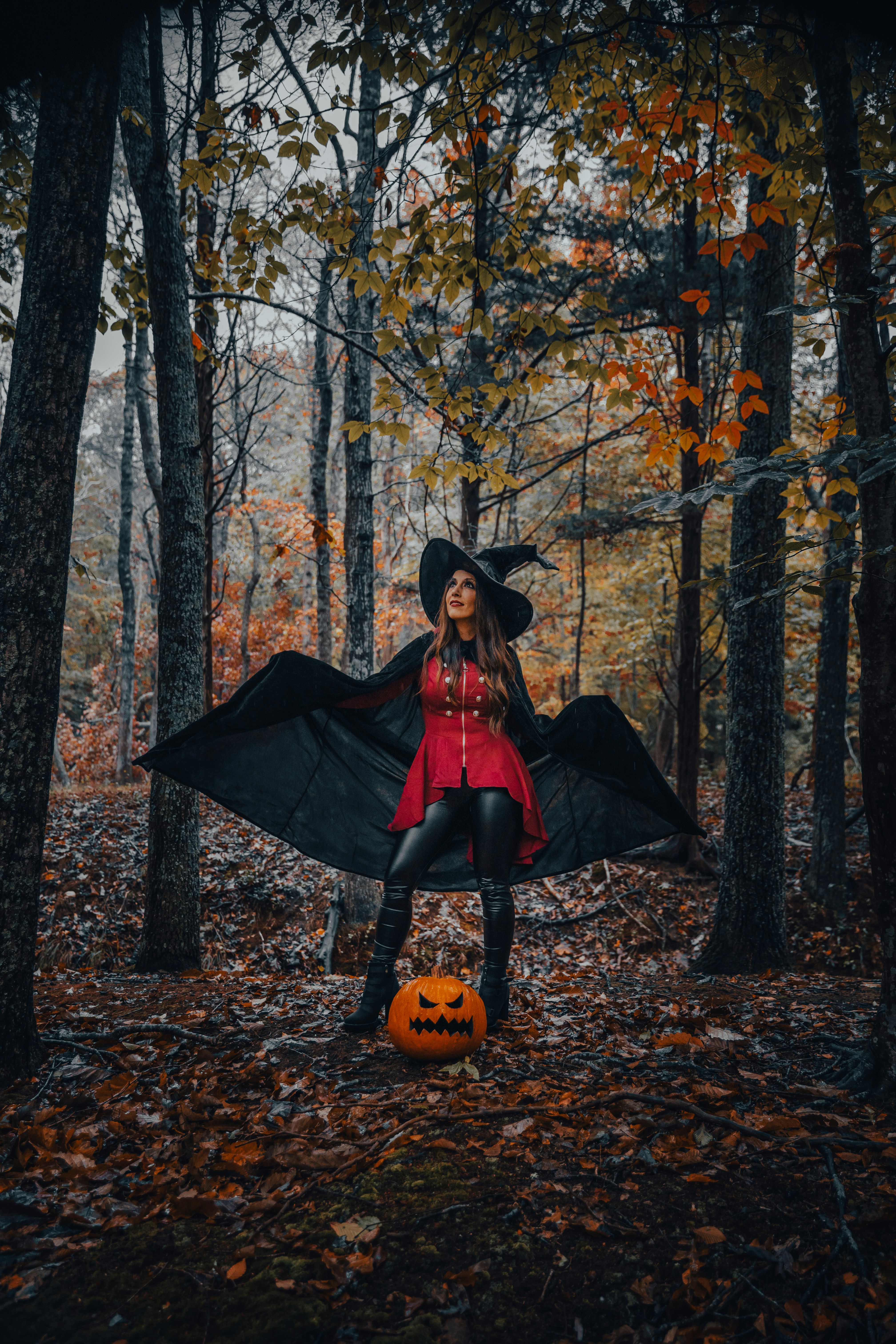 Witch in the Leaf-Littered Forest: Red Dress and Jack-o'-Lantern
