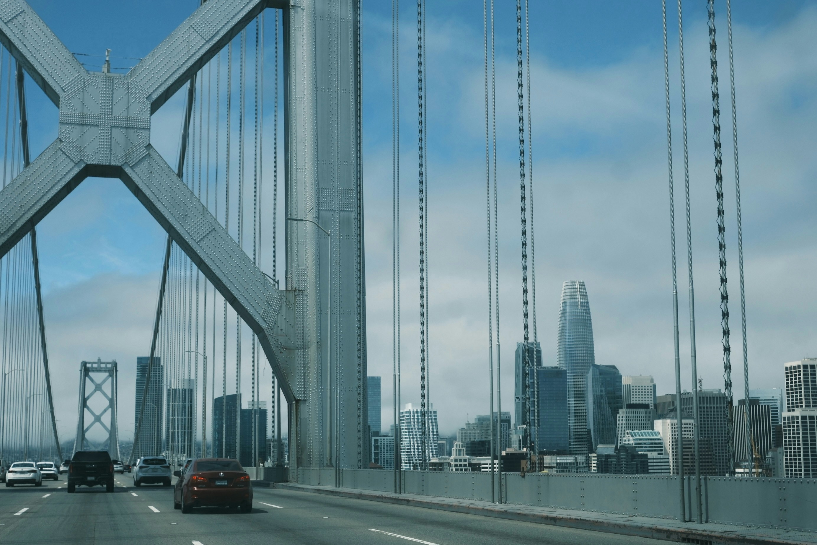 Steel Span and Skyline: Cars Crossing the Bay Bridge