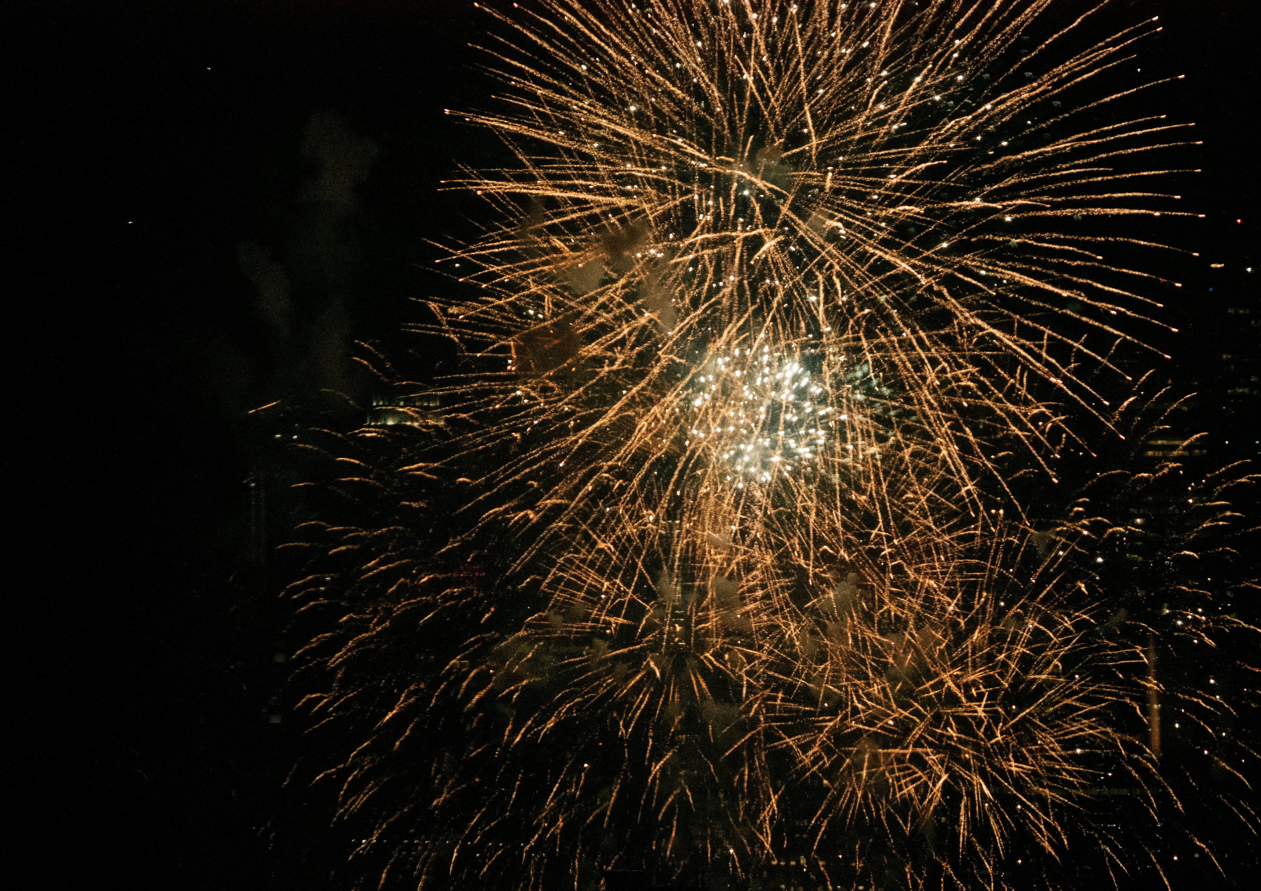 Golden Burst Overnight: Fireworks Illuminating the Night Sky