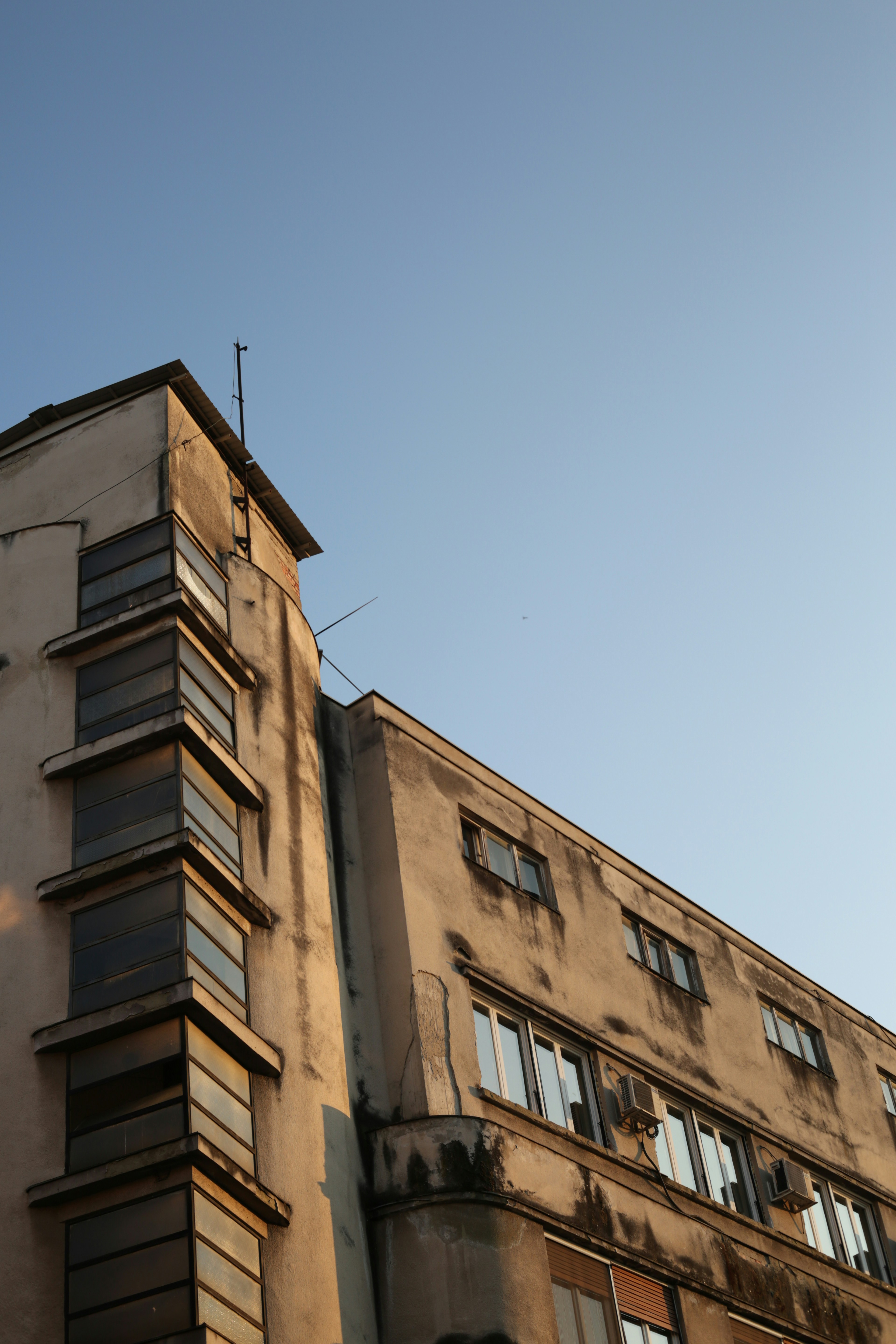 Weathered Edges: A Corner of Time on an Industrial Facade