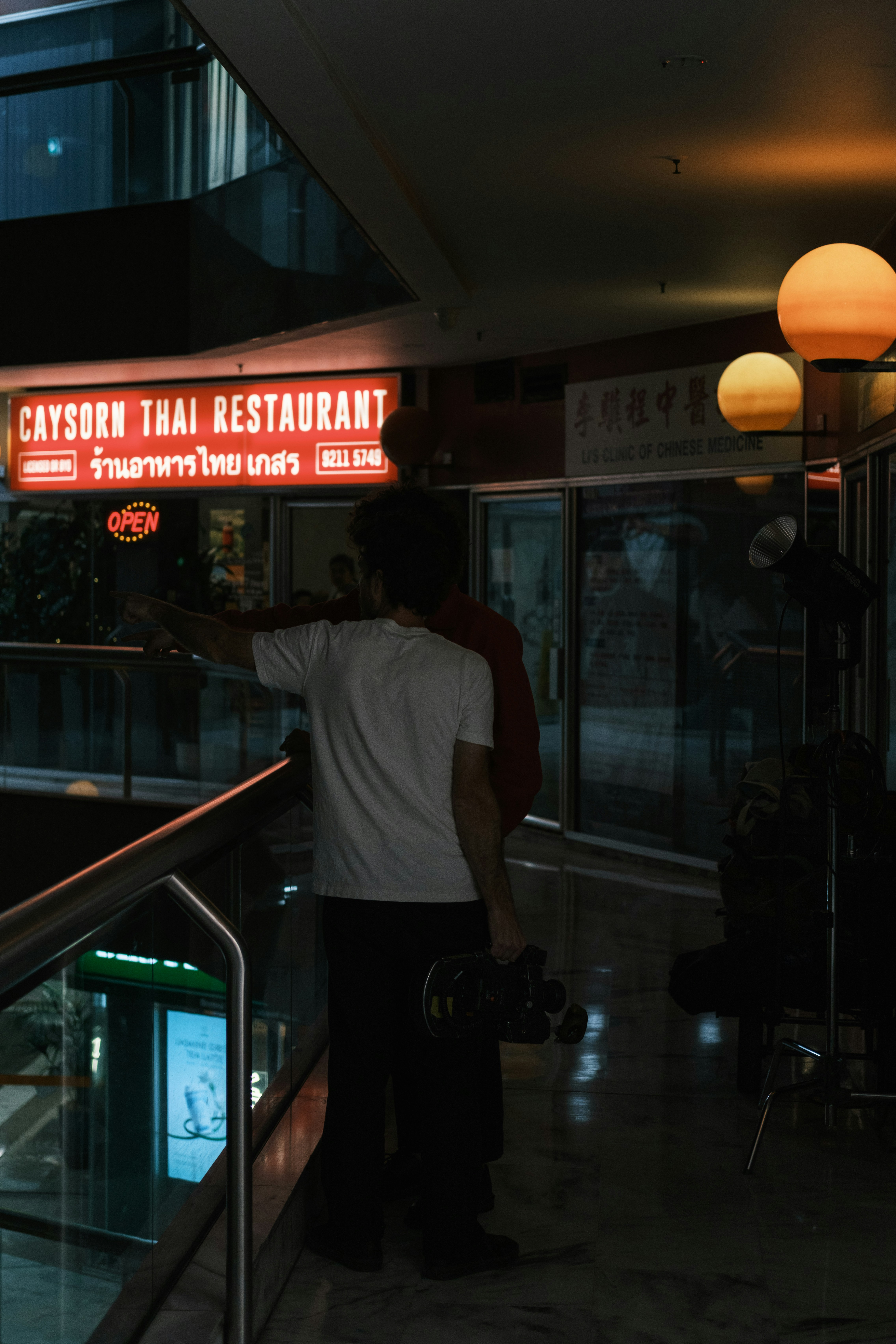 Camera crew pointing at dinner options mid production