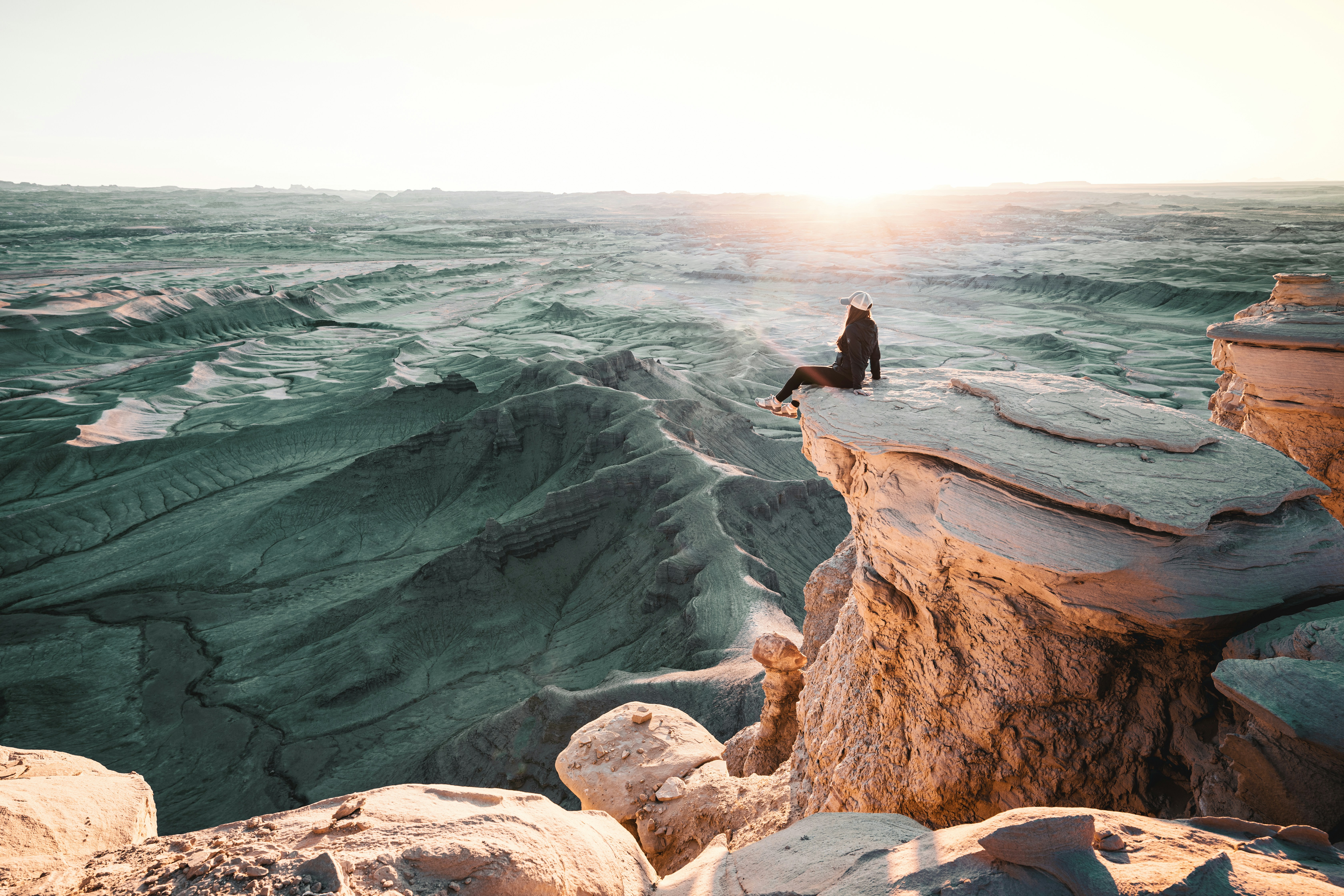 Edge of the World: Solo Figure at the Cliff's Crest at Sunset