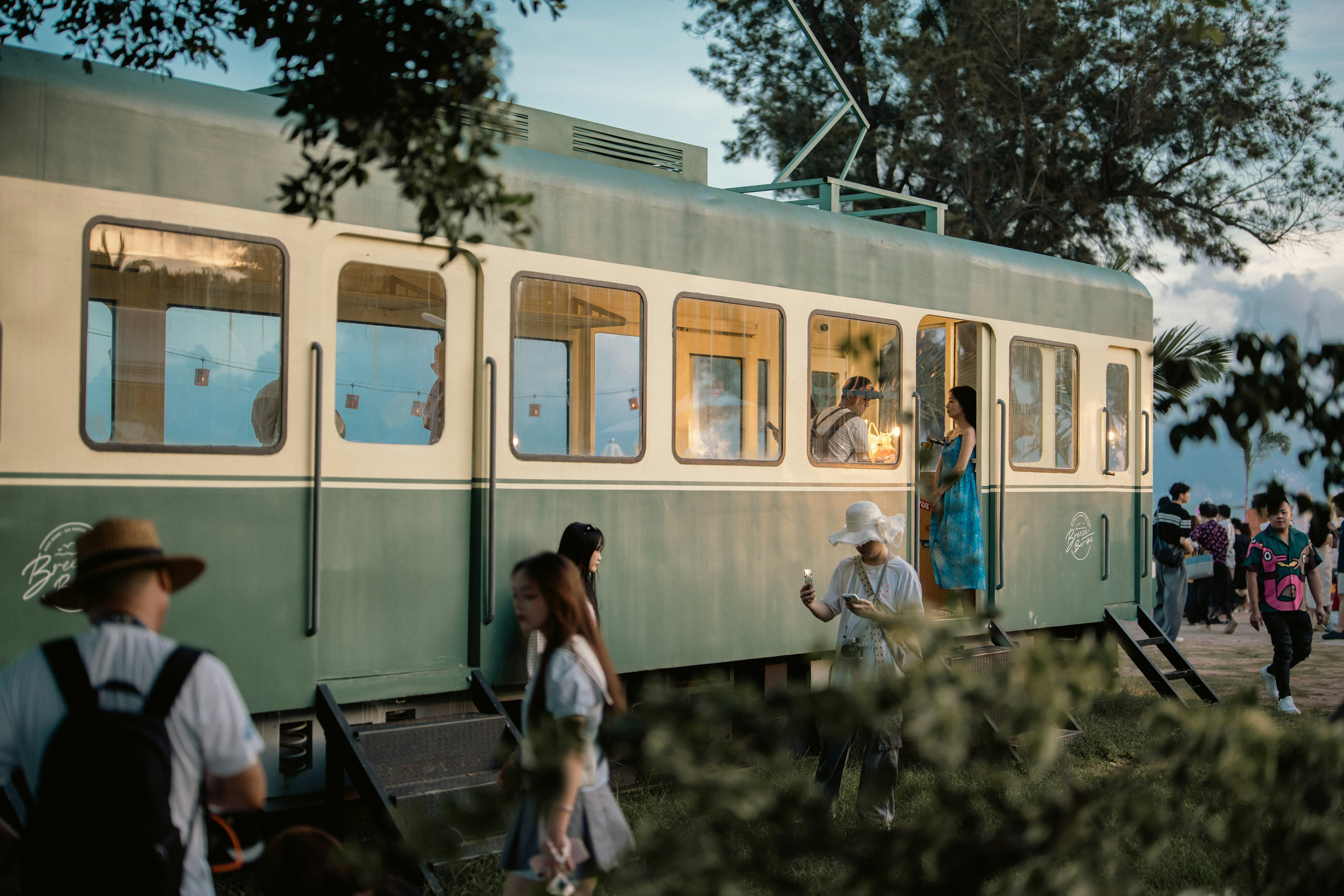 Transit Moments: People Gather at the Sunlit Car