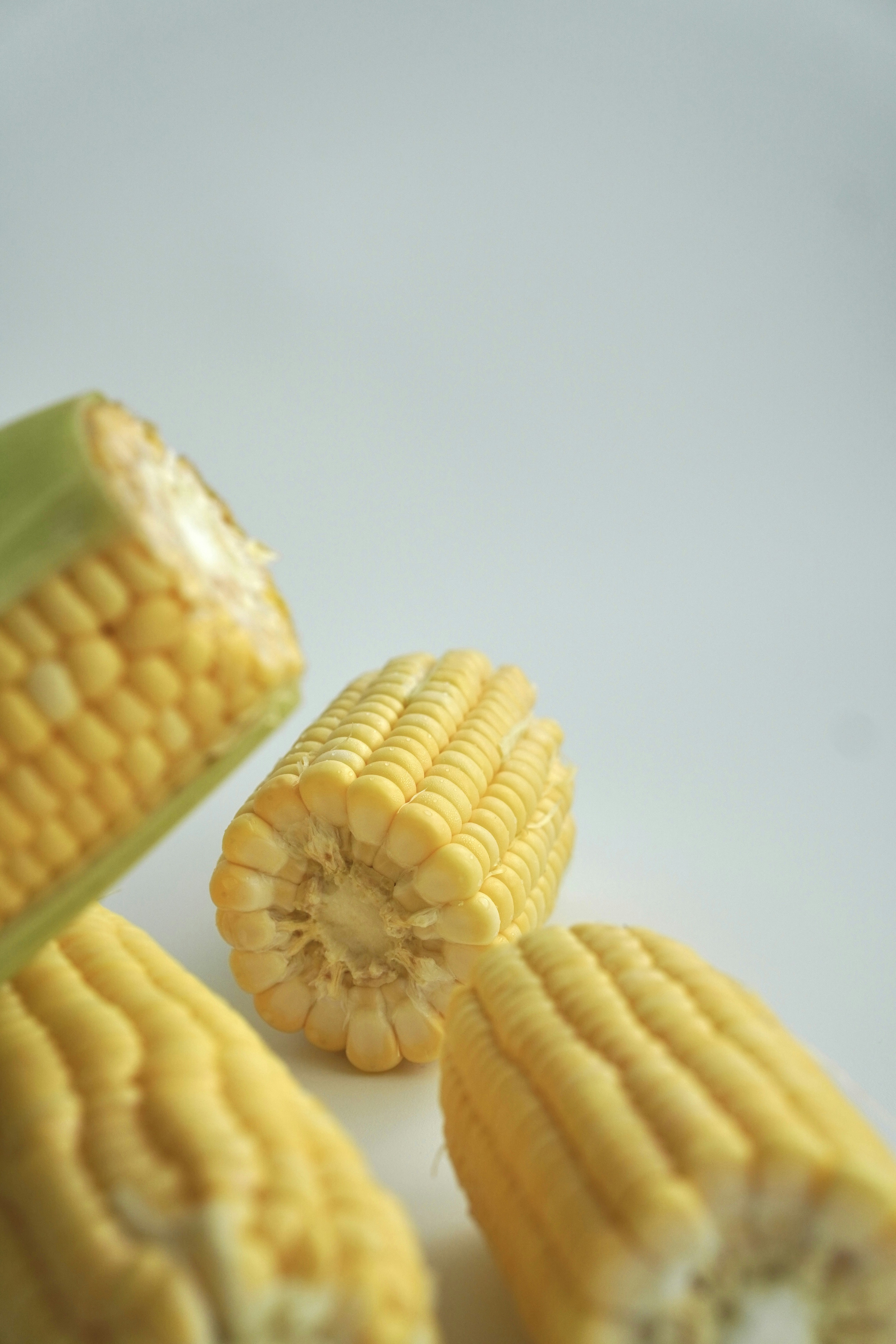 Sweet Sun-Kissed Kernels: Close-Up Corn on a White Plate