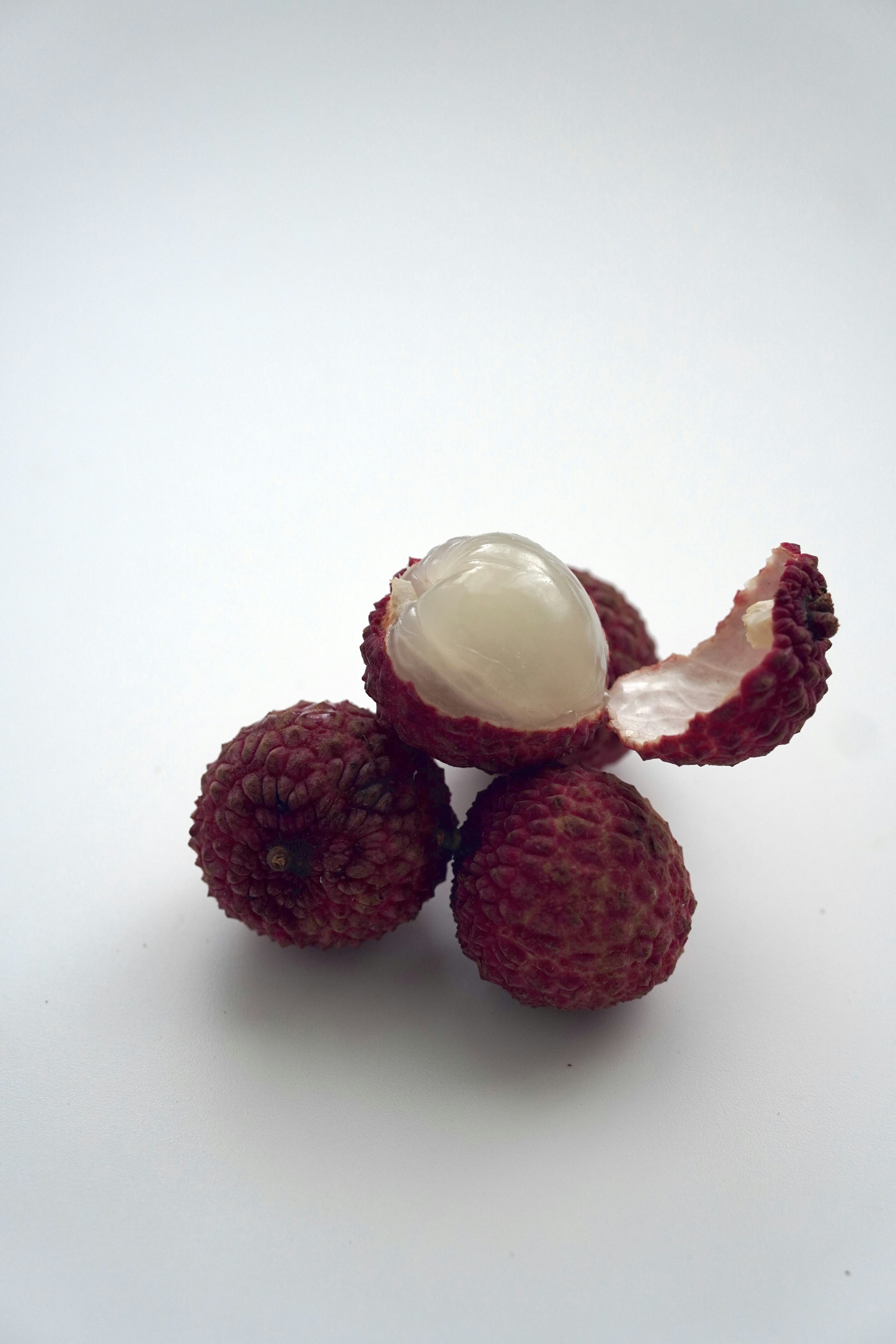 Lychees in Mild Spotlight: A Bite into Sweet Texture