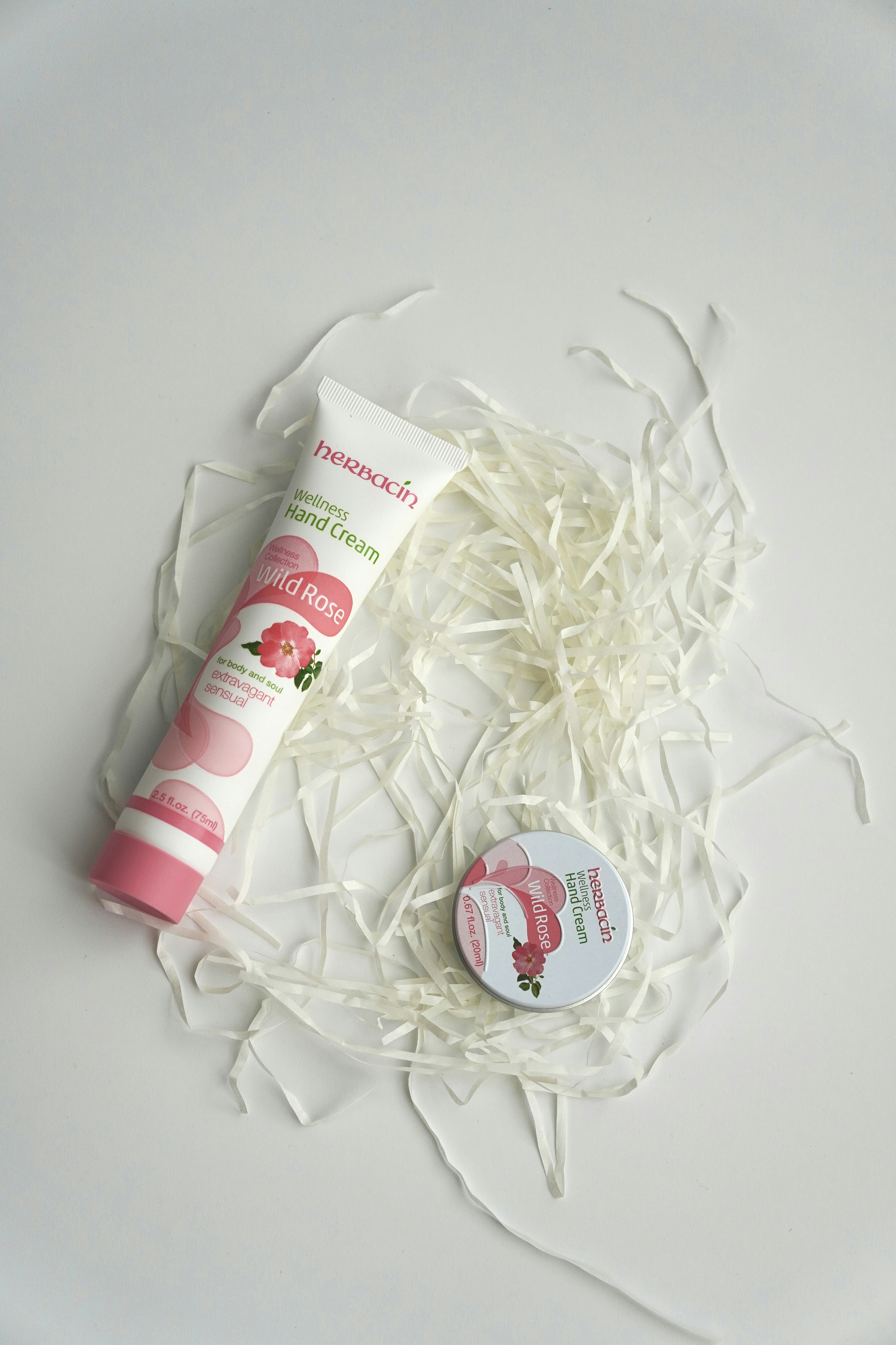 Soft Pink Wellness: Hand Cream and Balm on Shredded White