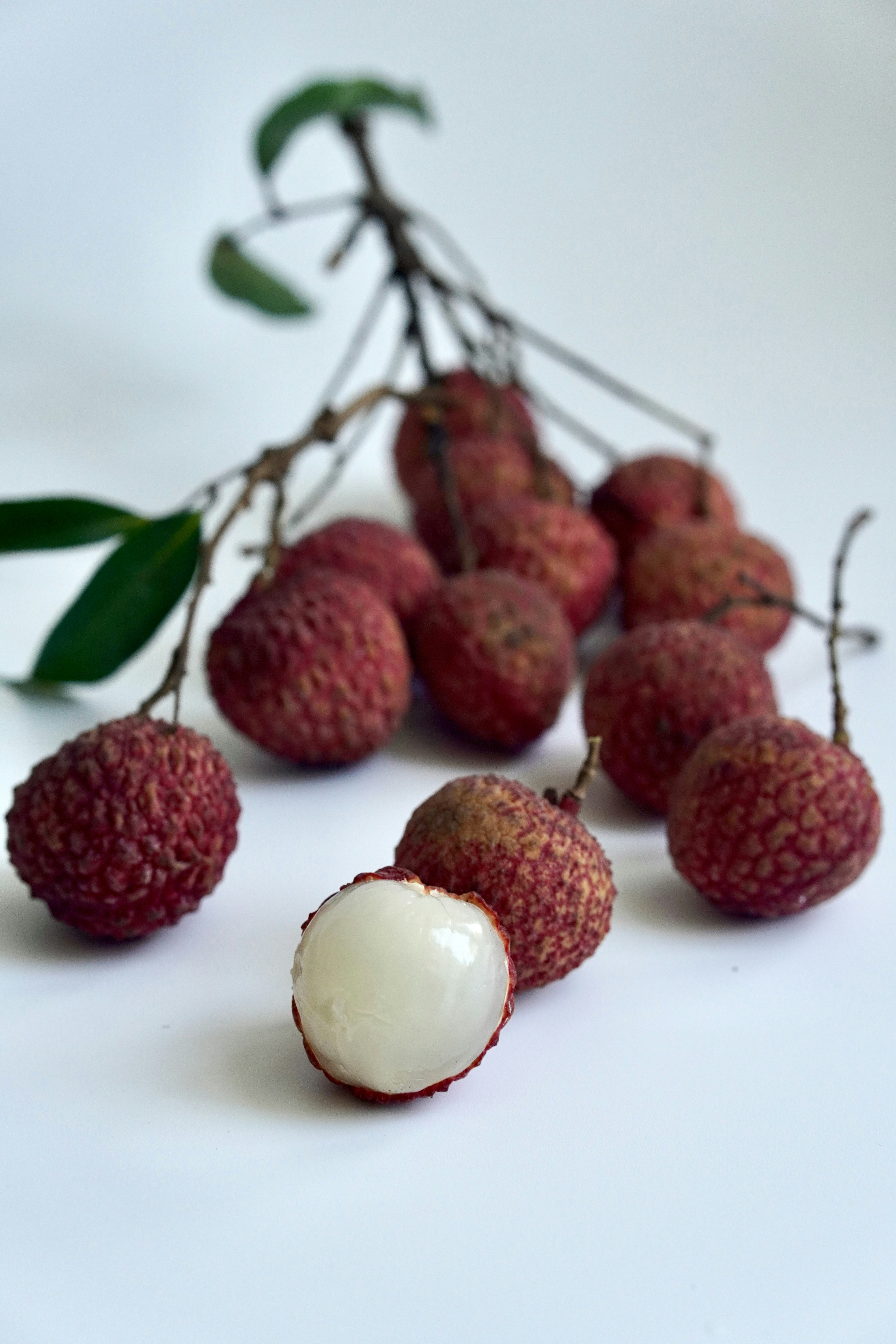 Lychee-like Berries on a Branch: A Close-Up of a White-Seeded Fruit