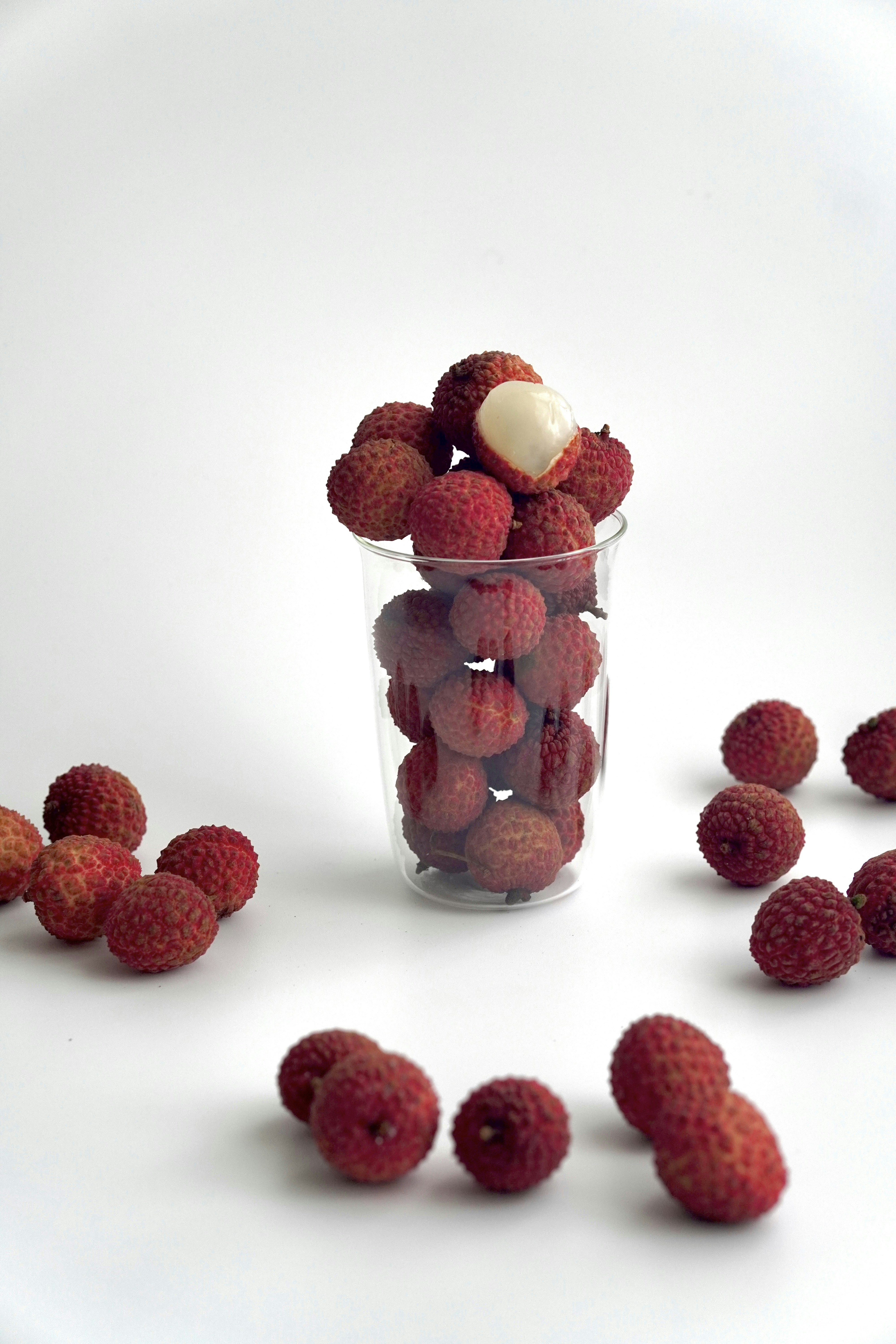 Crimson Orbs in a Glass: A Minimal Still Life