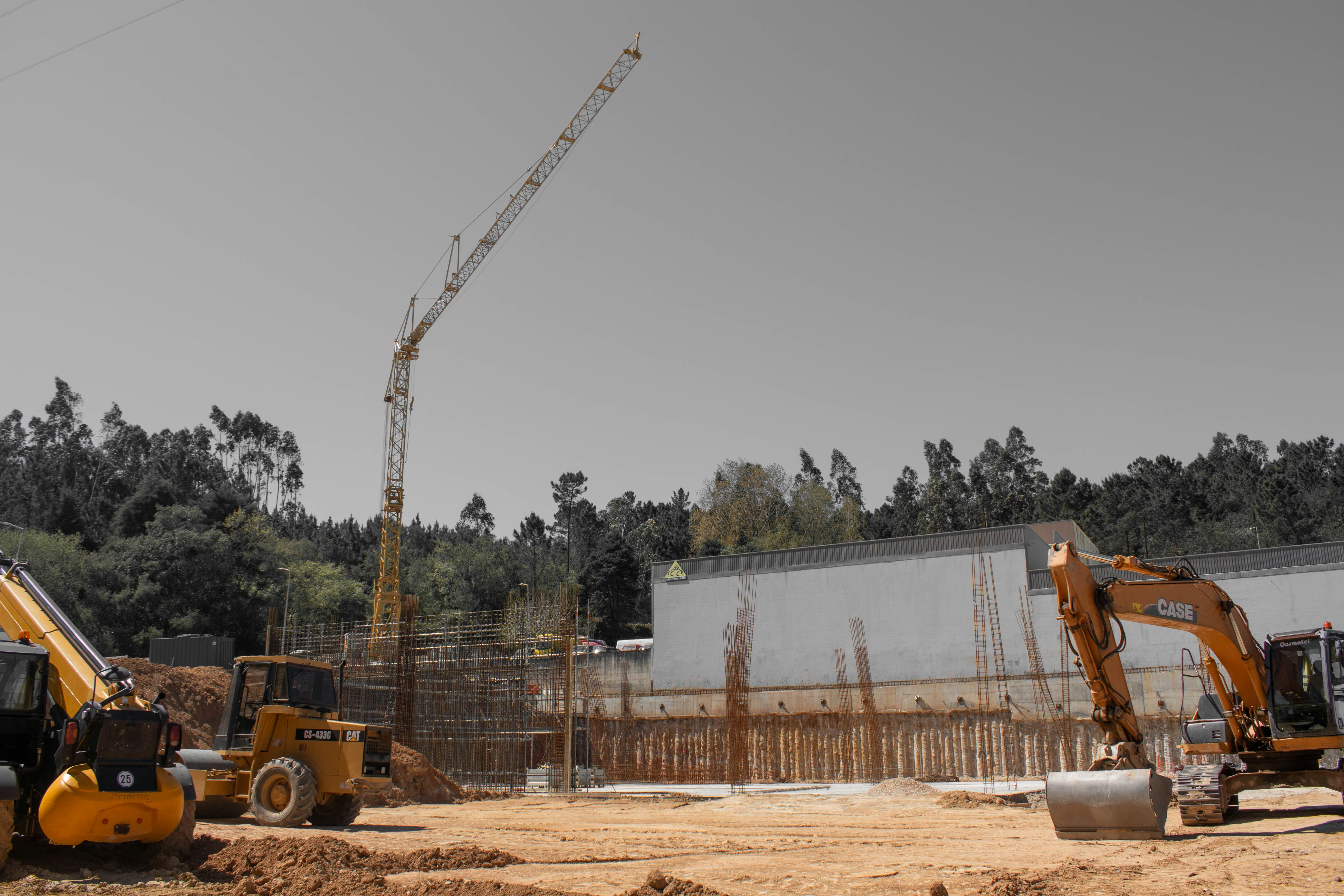 Towering Crane Crowned by Sky Over Groundwork