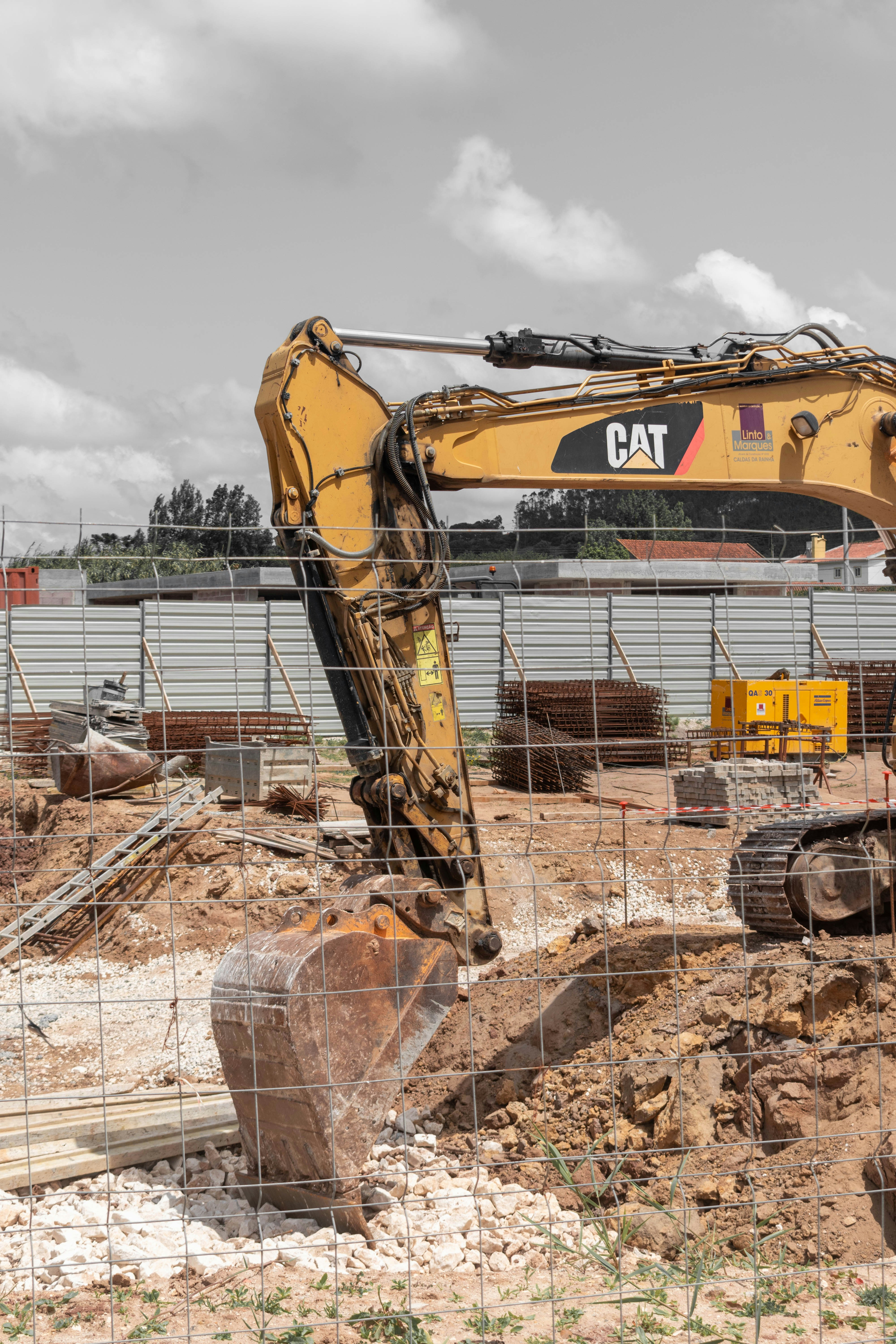 Giant Excavator Anchored in a Rough Construction Yard