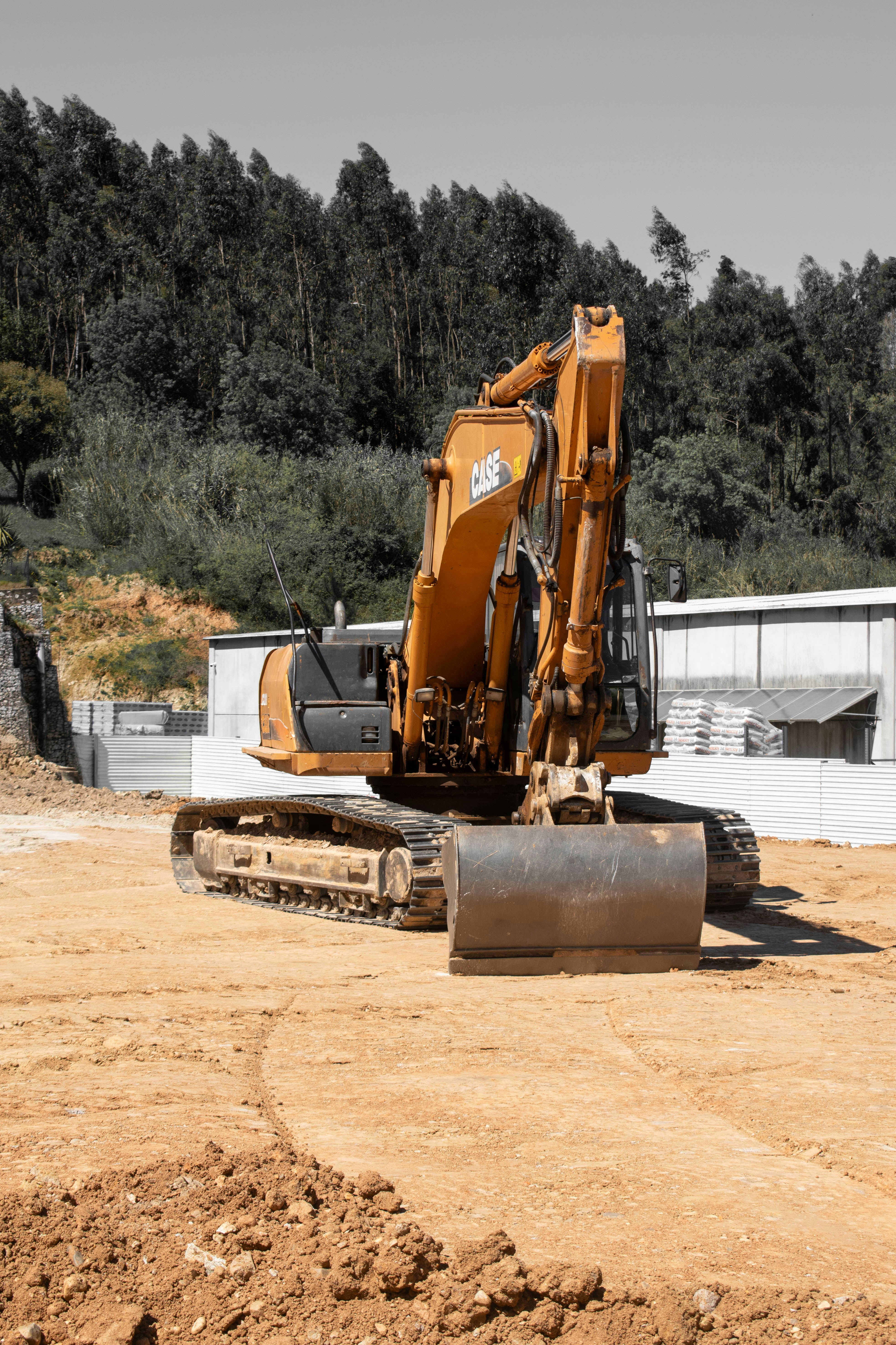 Mid-Field Power: Excavator Dominates a Quiet Construction Scene
