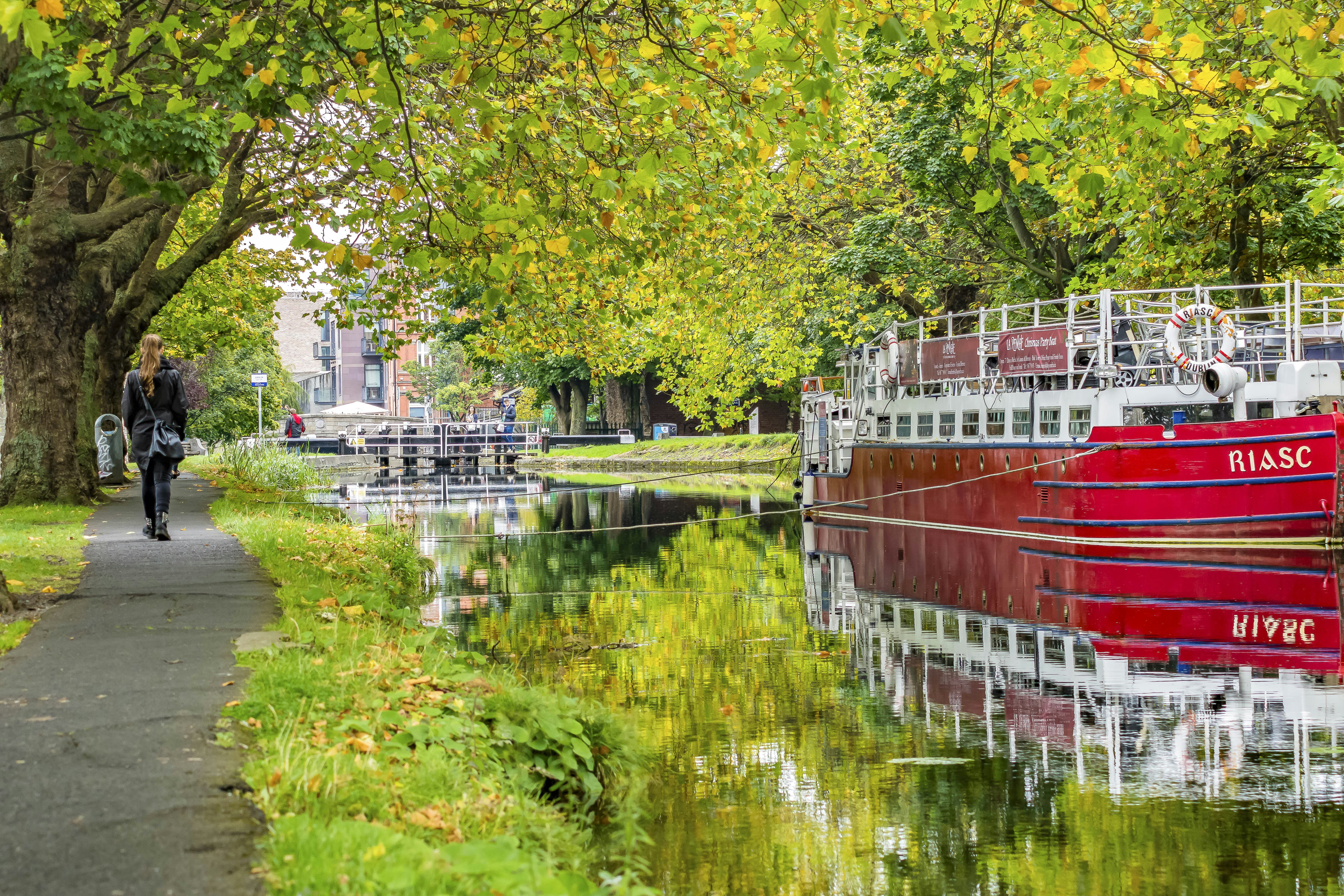 Quiet Riverside Walk with a Crimson Boat Echo