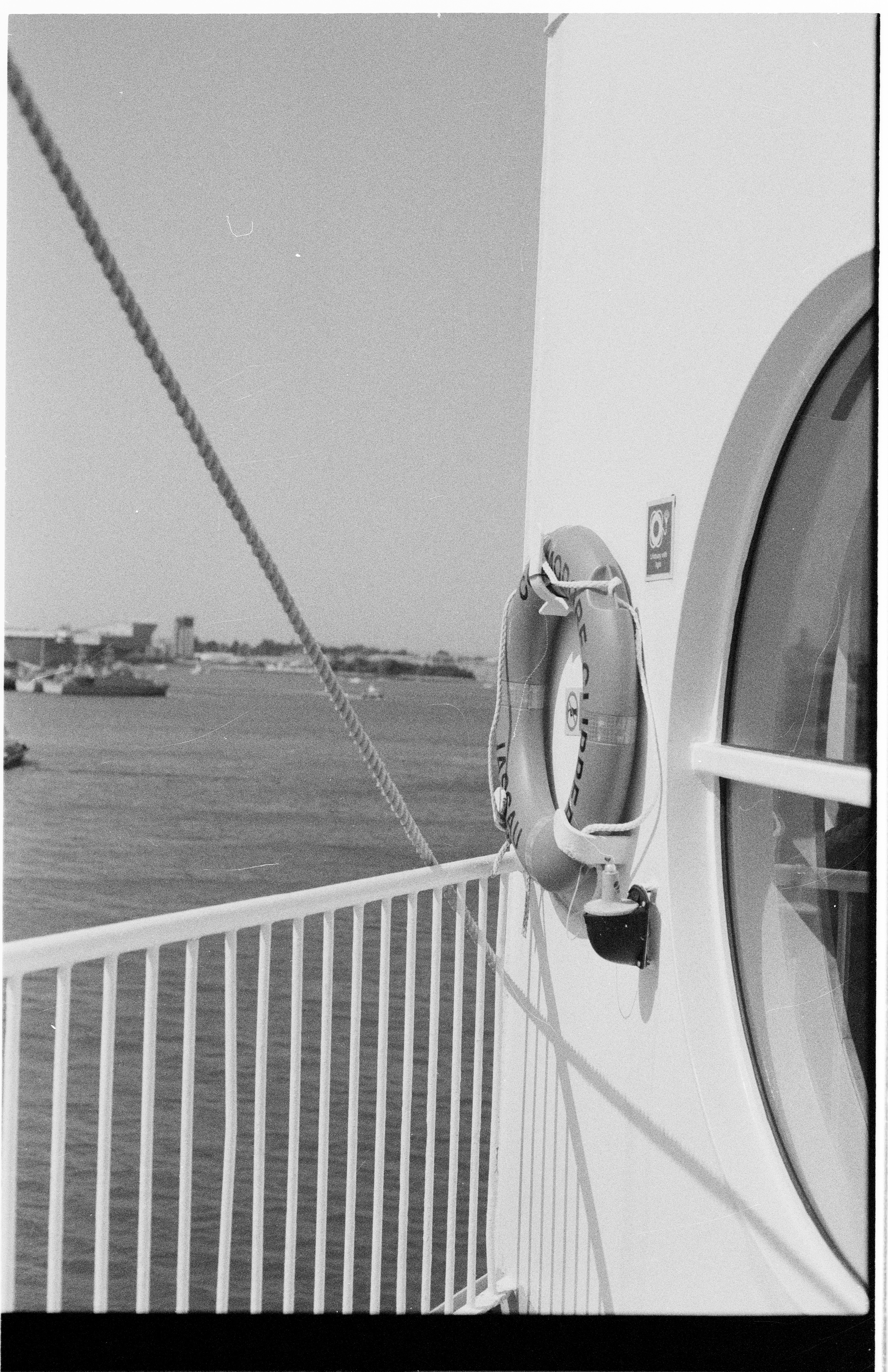 Lifebuoy on the Vessel’s Exterior: A Quiet Harbor View