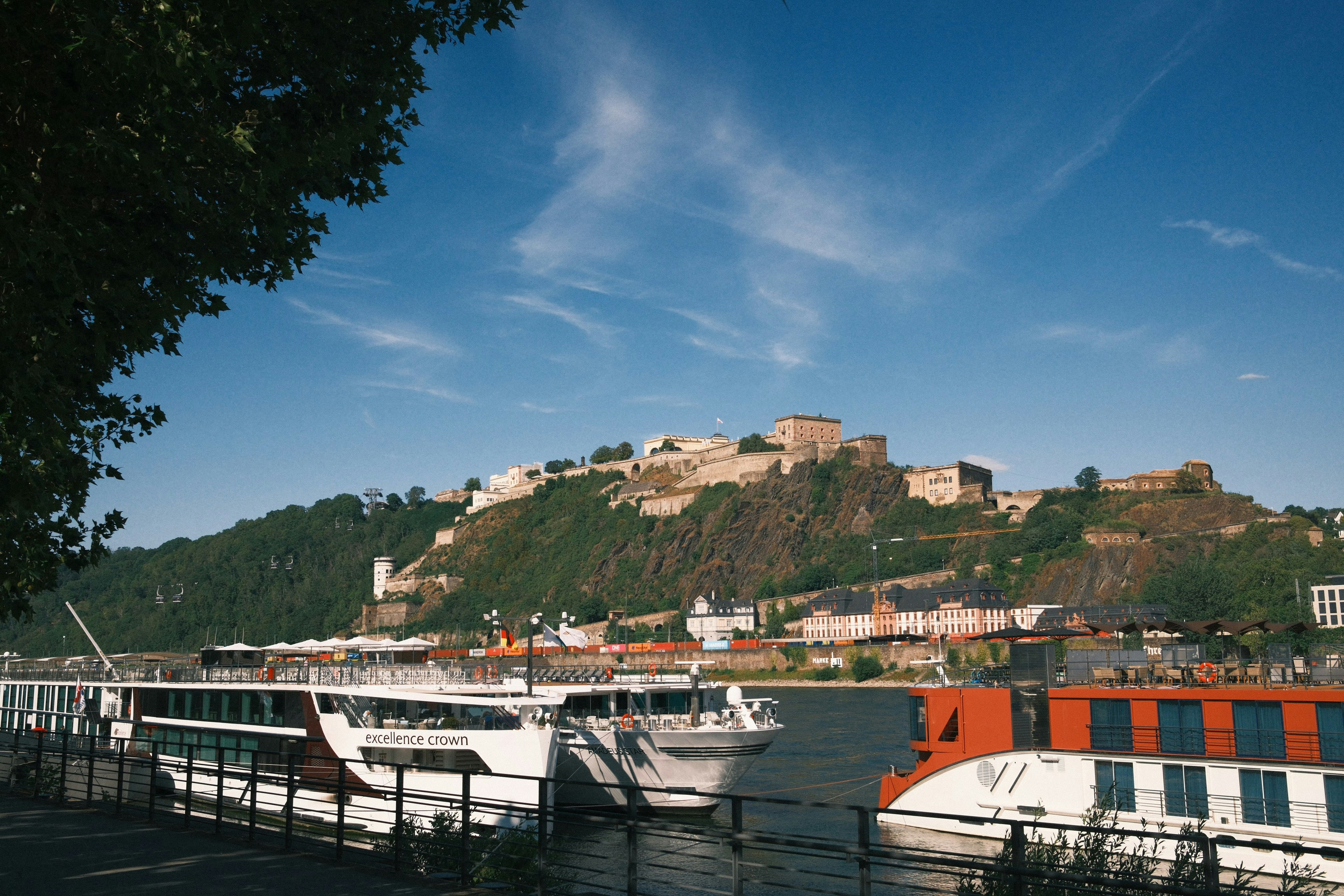Harbor Jewel: Boats at Rest with a Hilltop Fortress