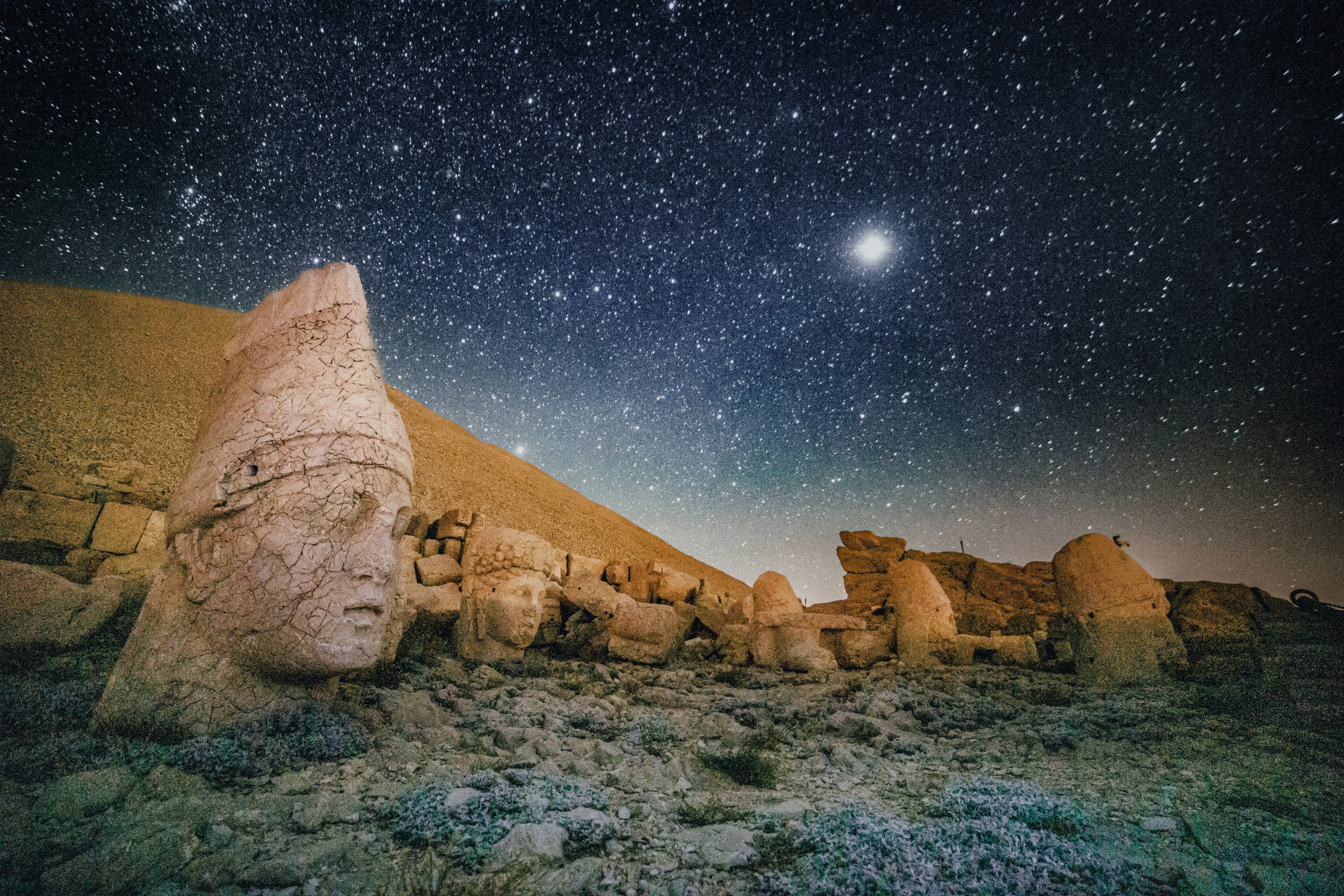 Celestial Giants Beneath Ancient Carved Faces