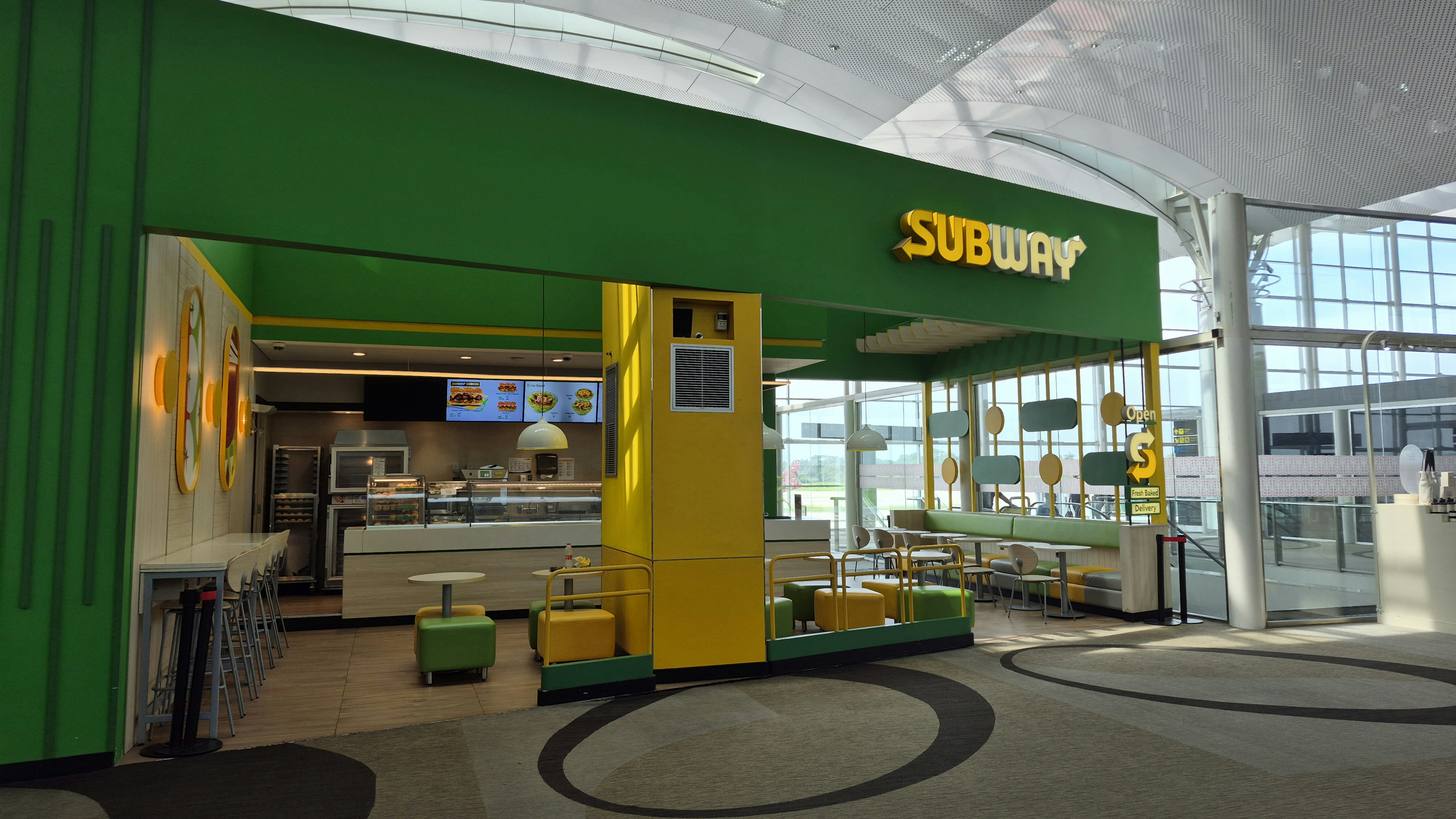 Bright Green Subway Frontage with Counter and Seating