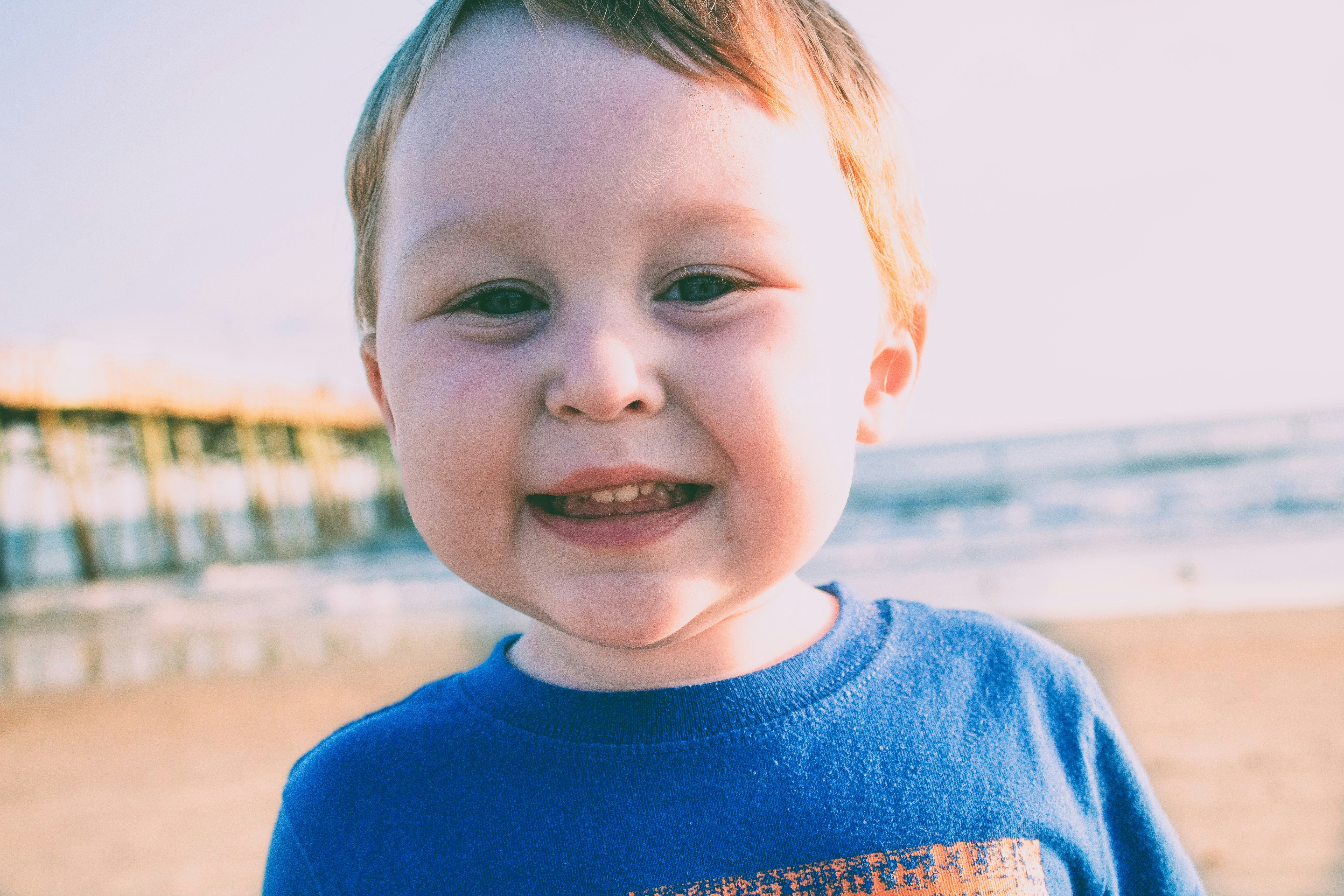 Smiley seaside portrait with sunlit backdrop