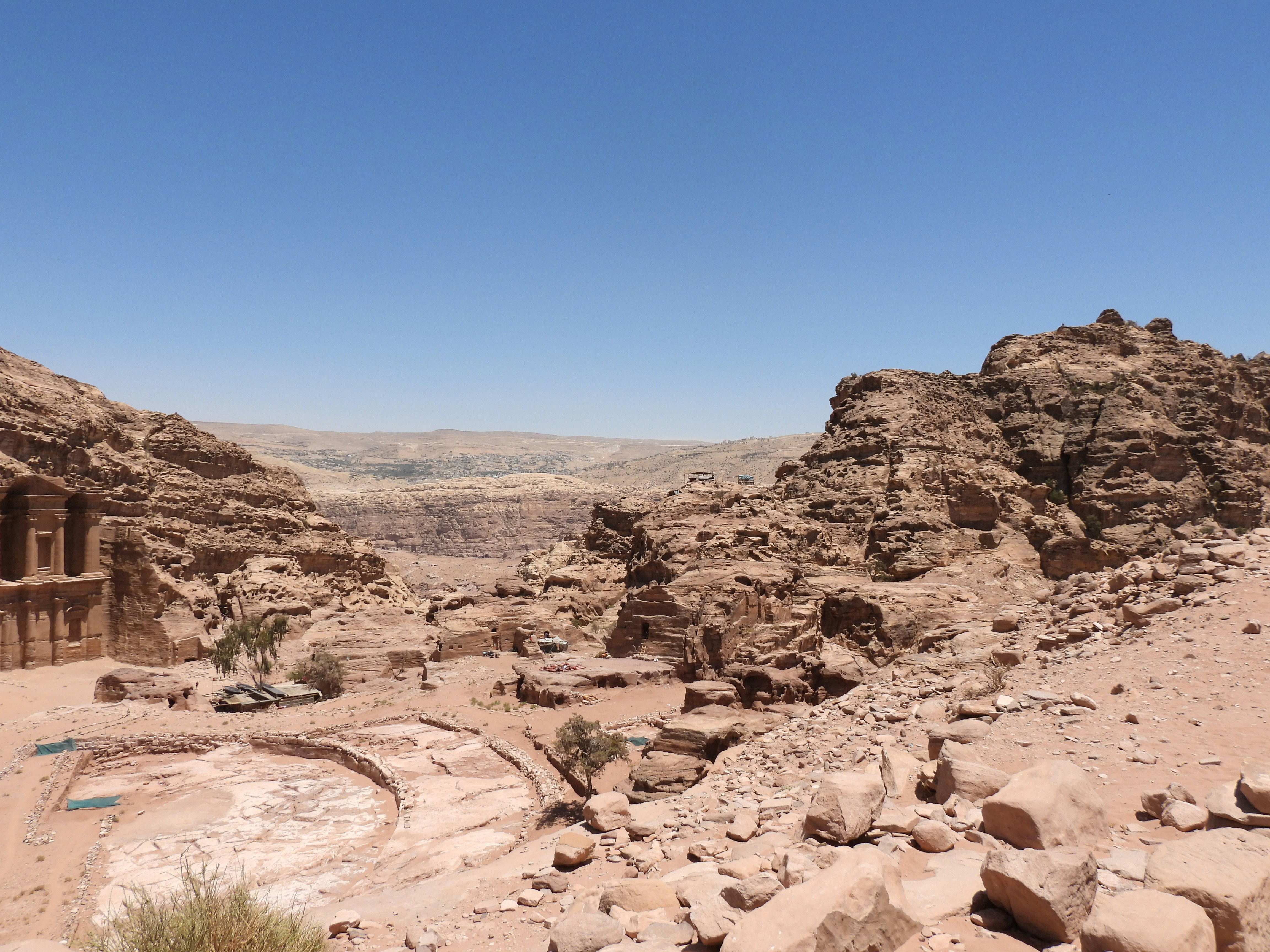 Desert Ruins at Noon: Carved Canyon Remnants under a Clear Sky