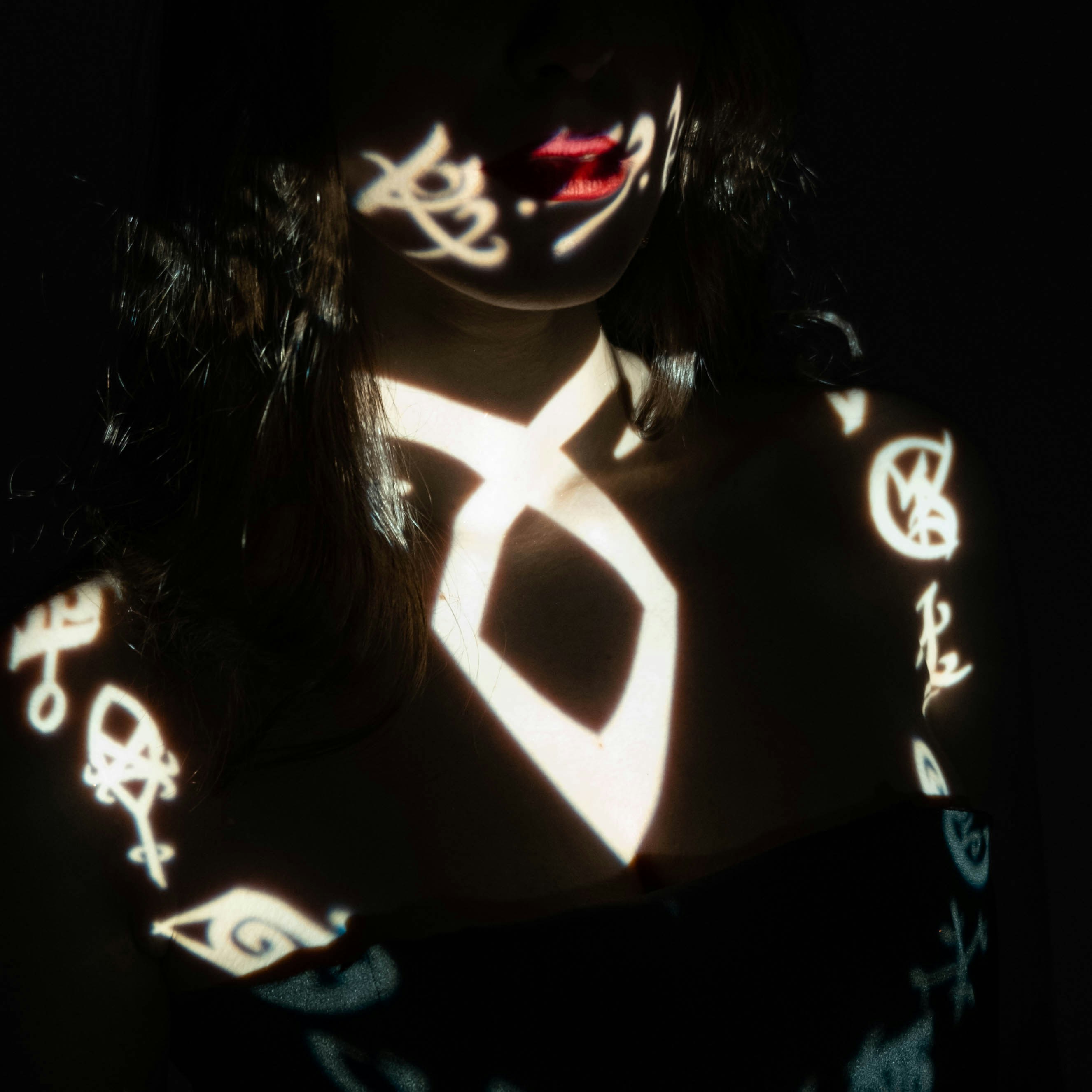 Neon Glyphs on Skin: A Shadowed Silhouette of Light