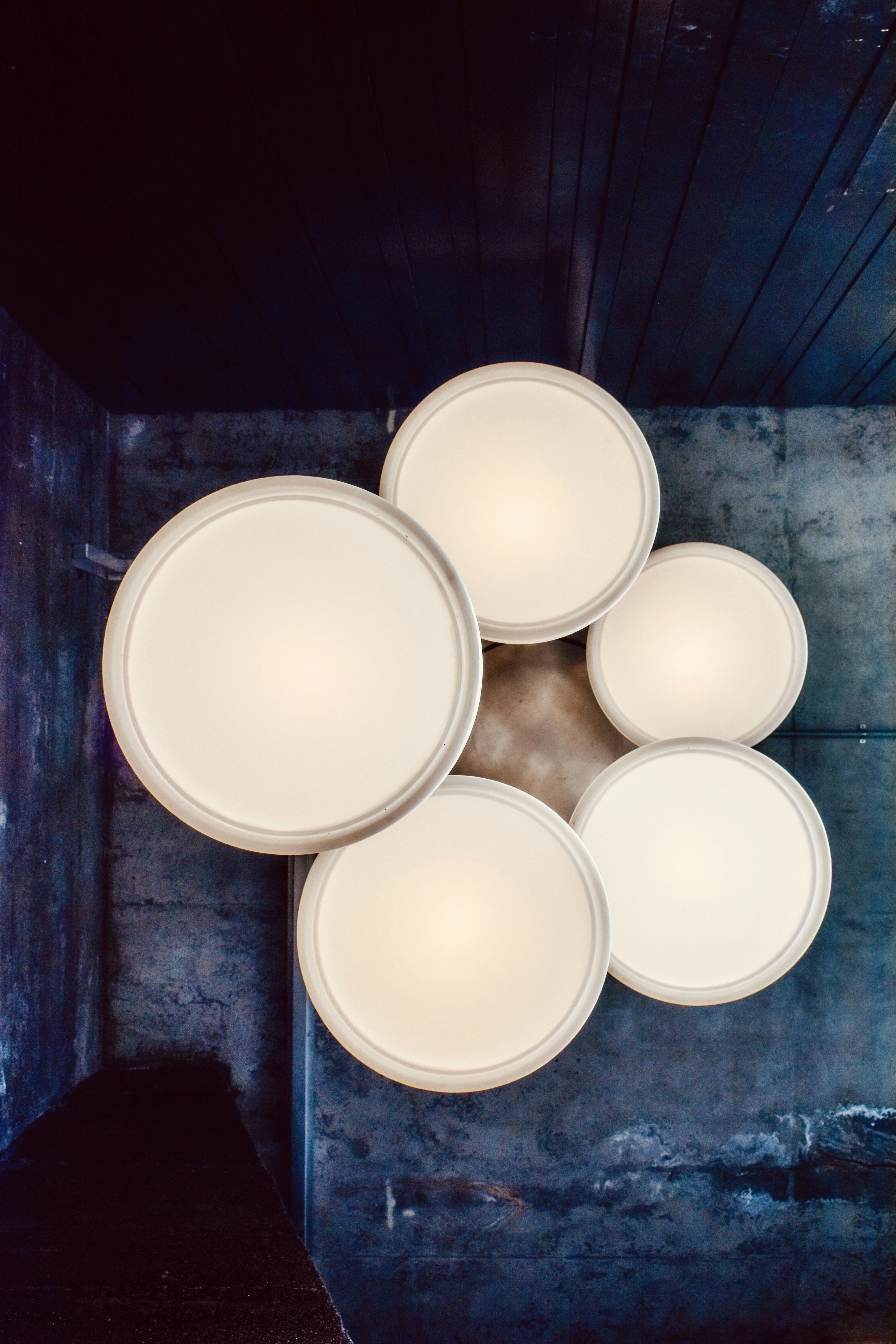 Central Bloom: Overhead View of Paint Cans Converging in a Circular Bouquet