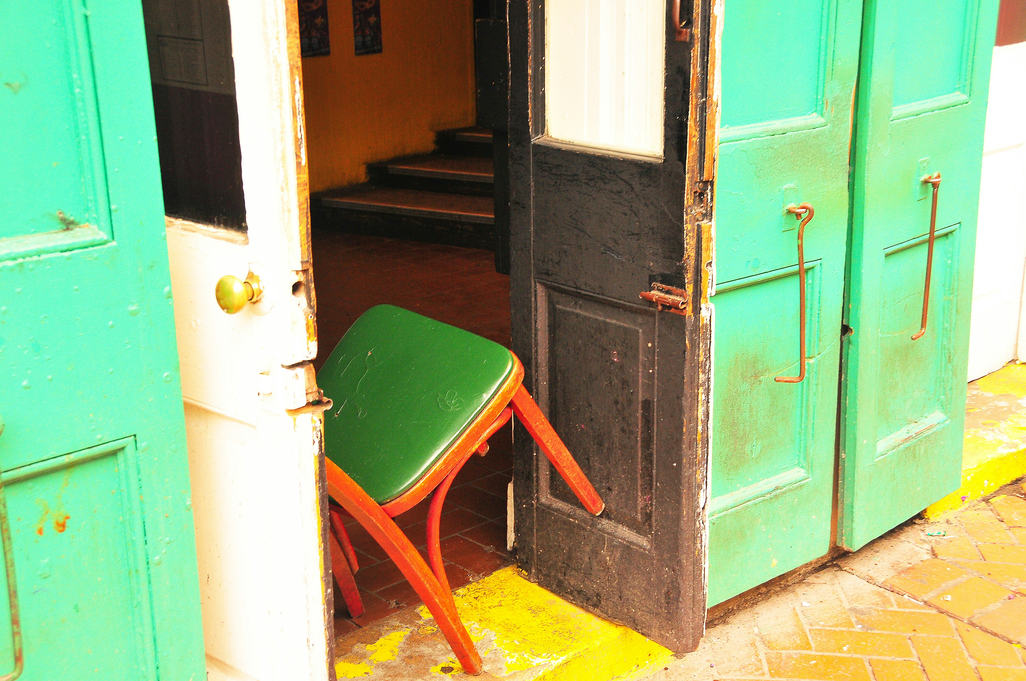 Green Doors and a Tilted Stool: Welcome to the Quiet Interior