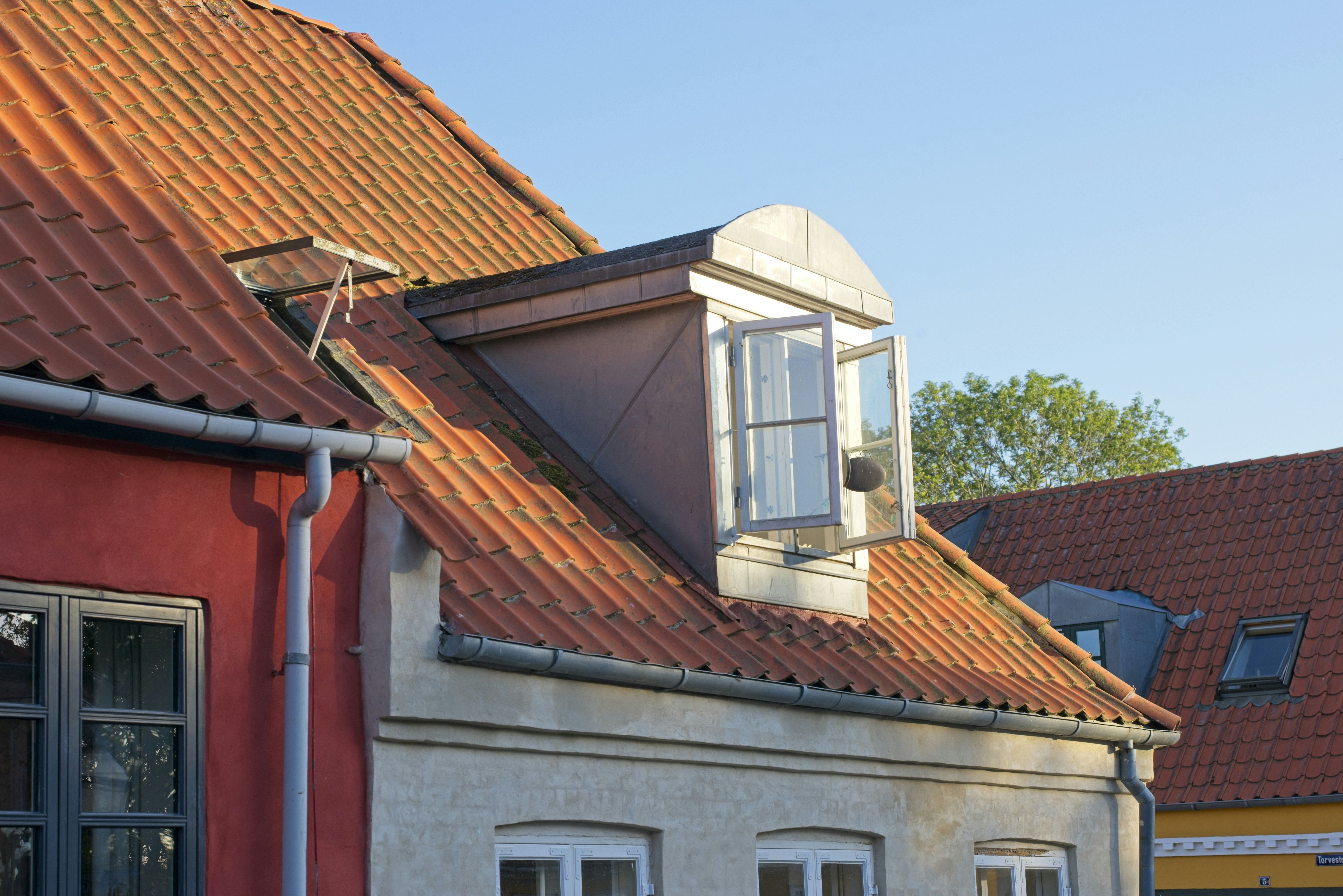 Sunny Rooftops and a Dormer Window Catch the Light