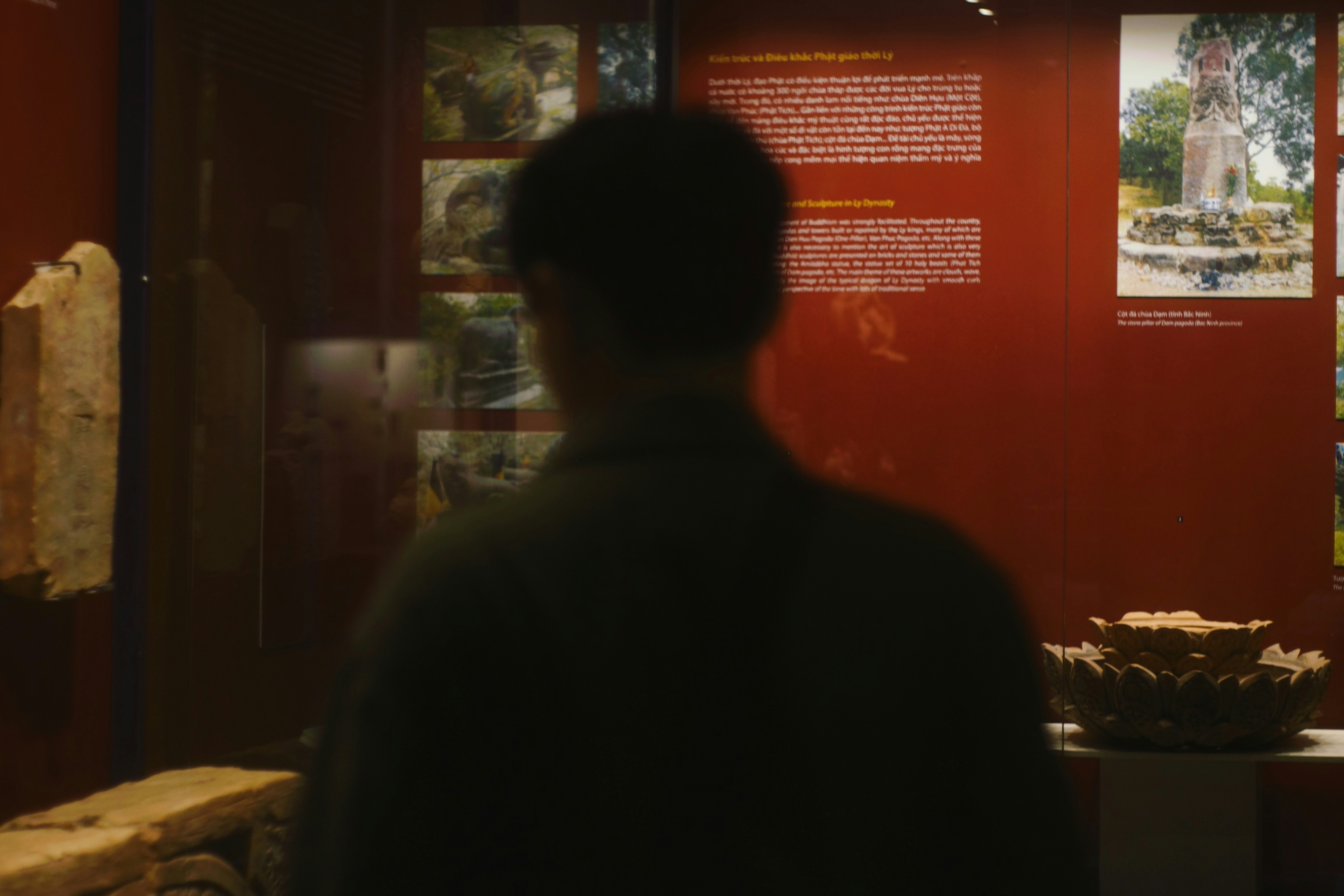 Shadowed Visitor in a Museum Hall of Echoes