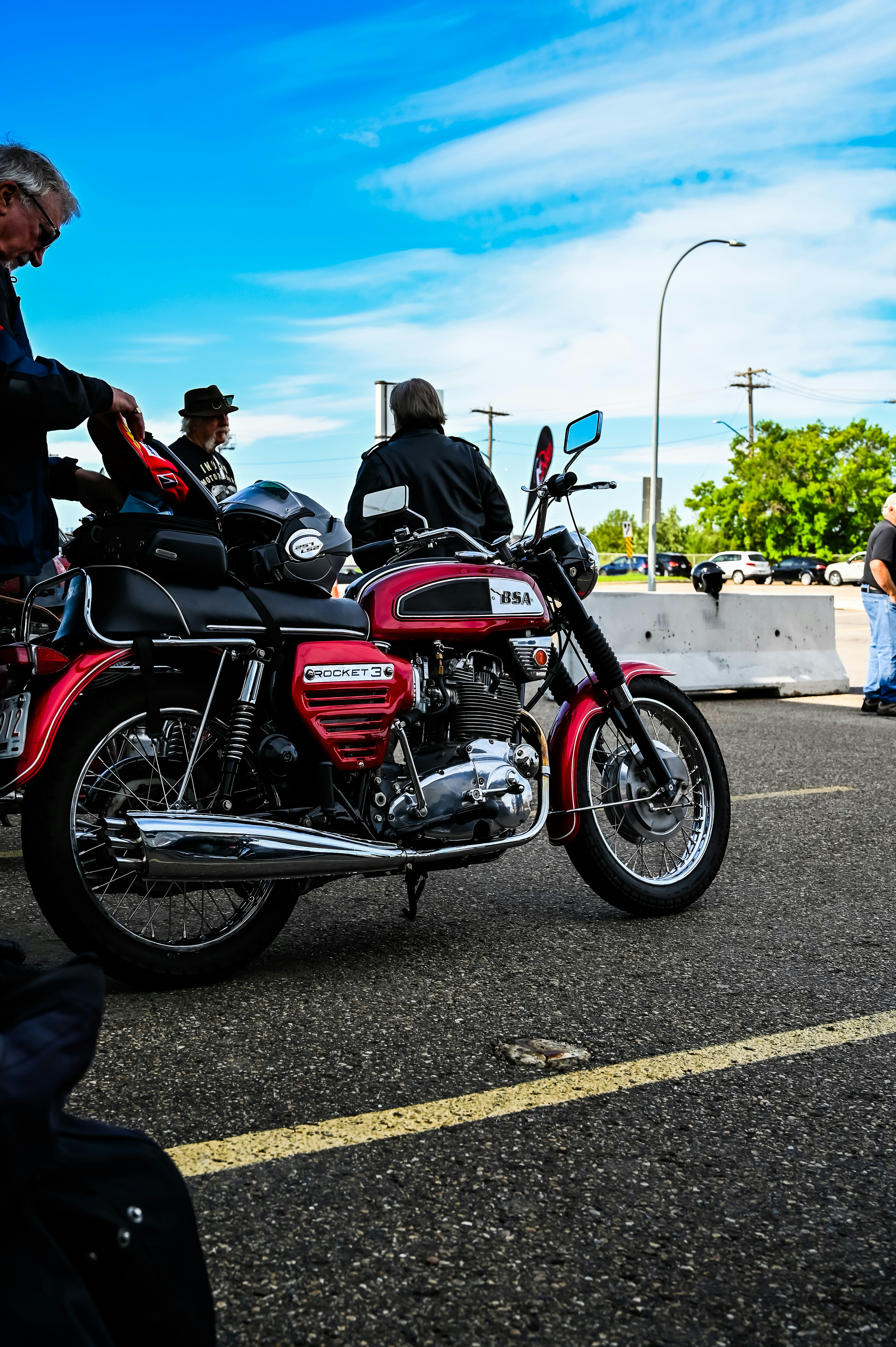 Red Classic: A Moment with Vintage Motorcycles in the Parking Lot