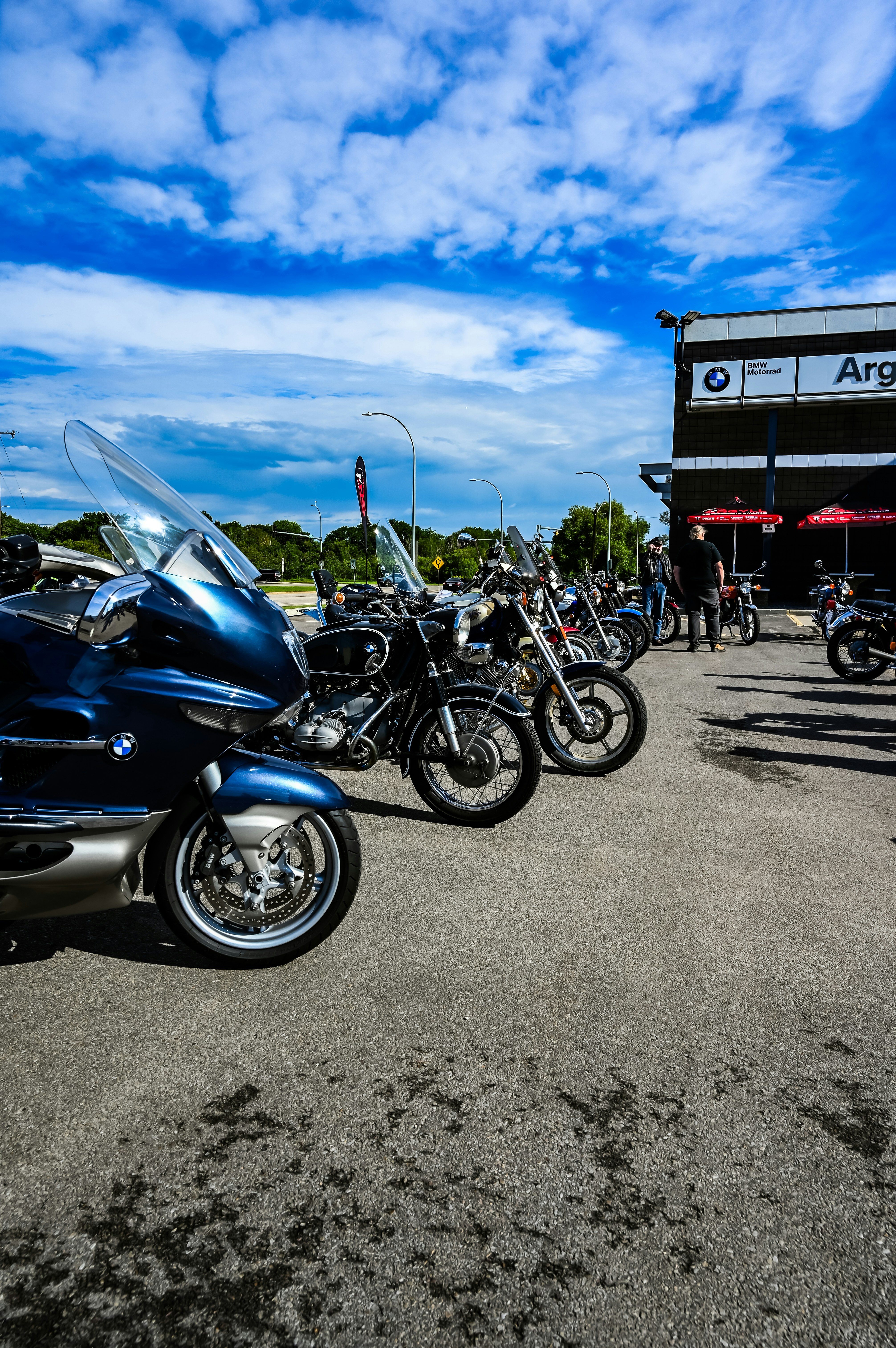 Line of Chrome: Motorbikes Rest Against the Evening Sky