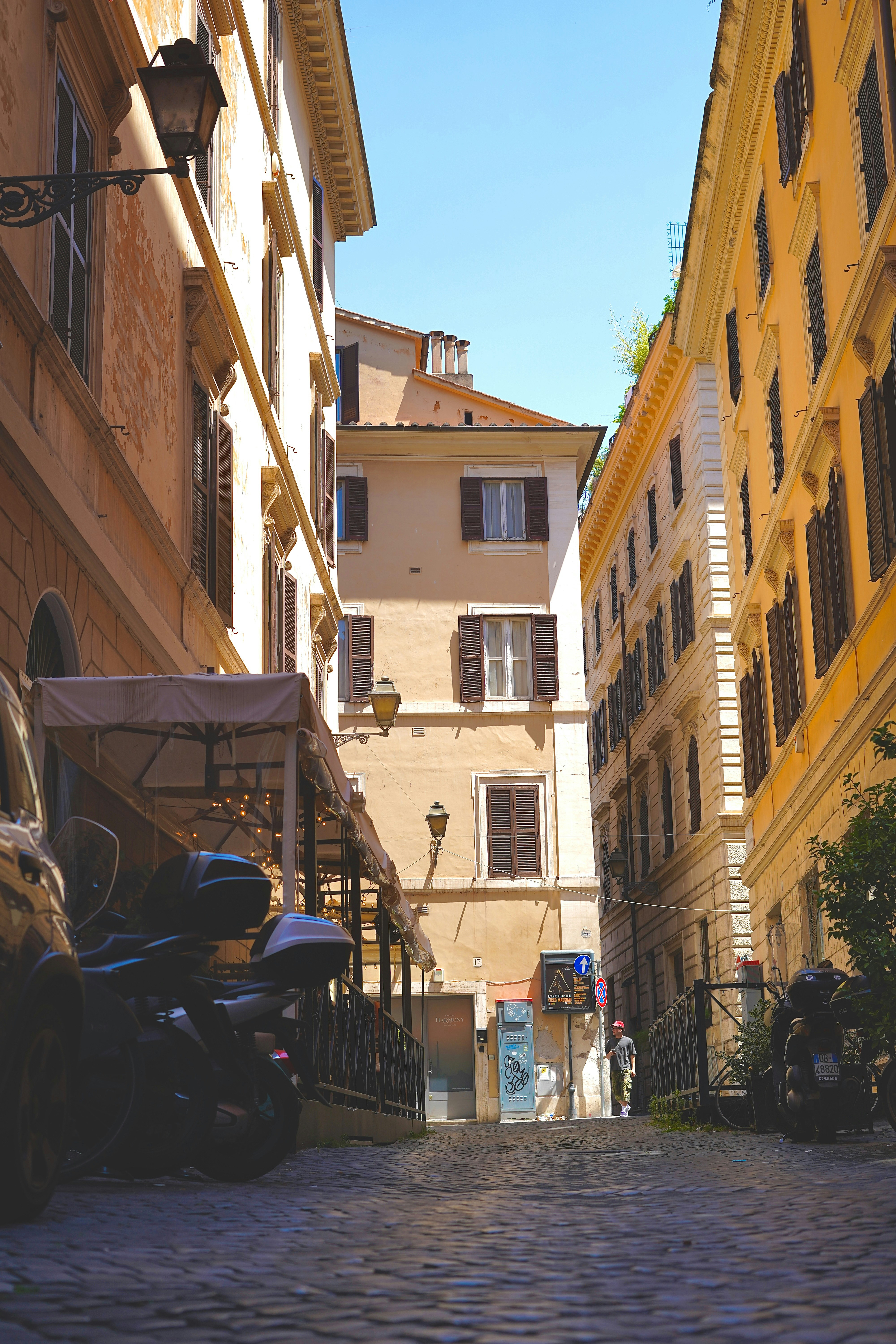Narrow Roman Street: Dawn Light Between Warm Facades