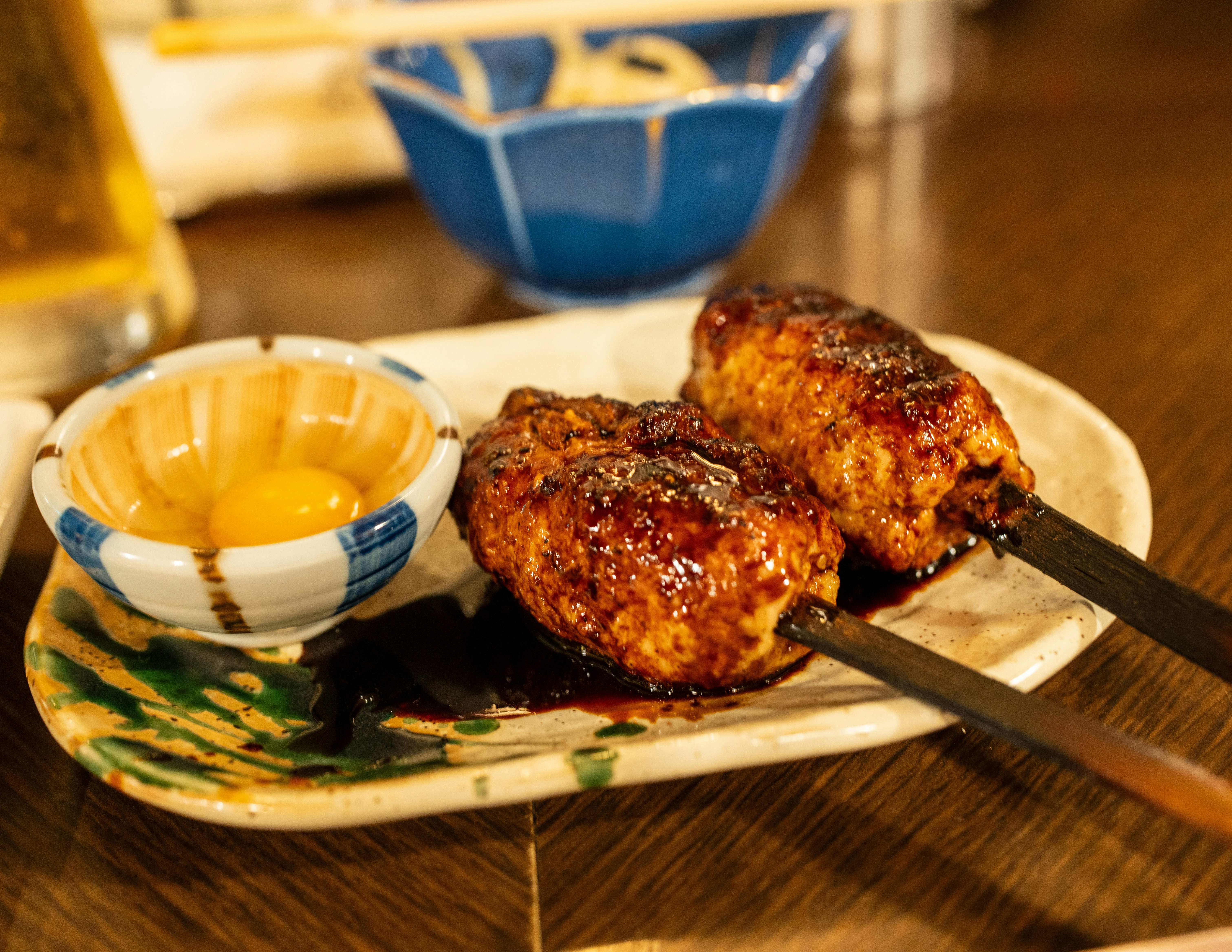 Charred Yakitori Duo on a glossy Plate with a Saucy Glaze