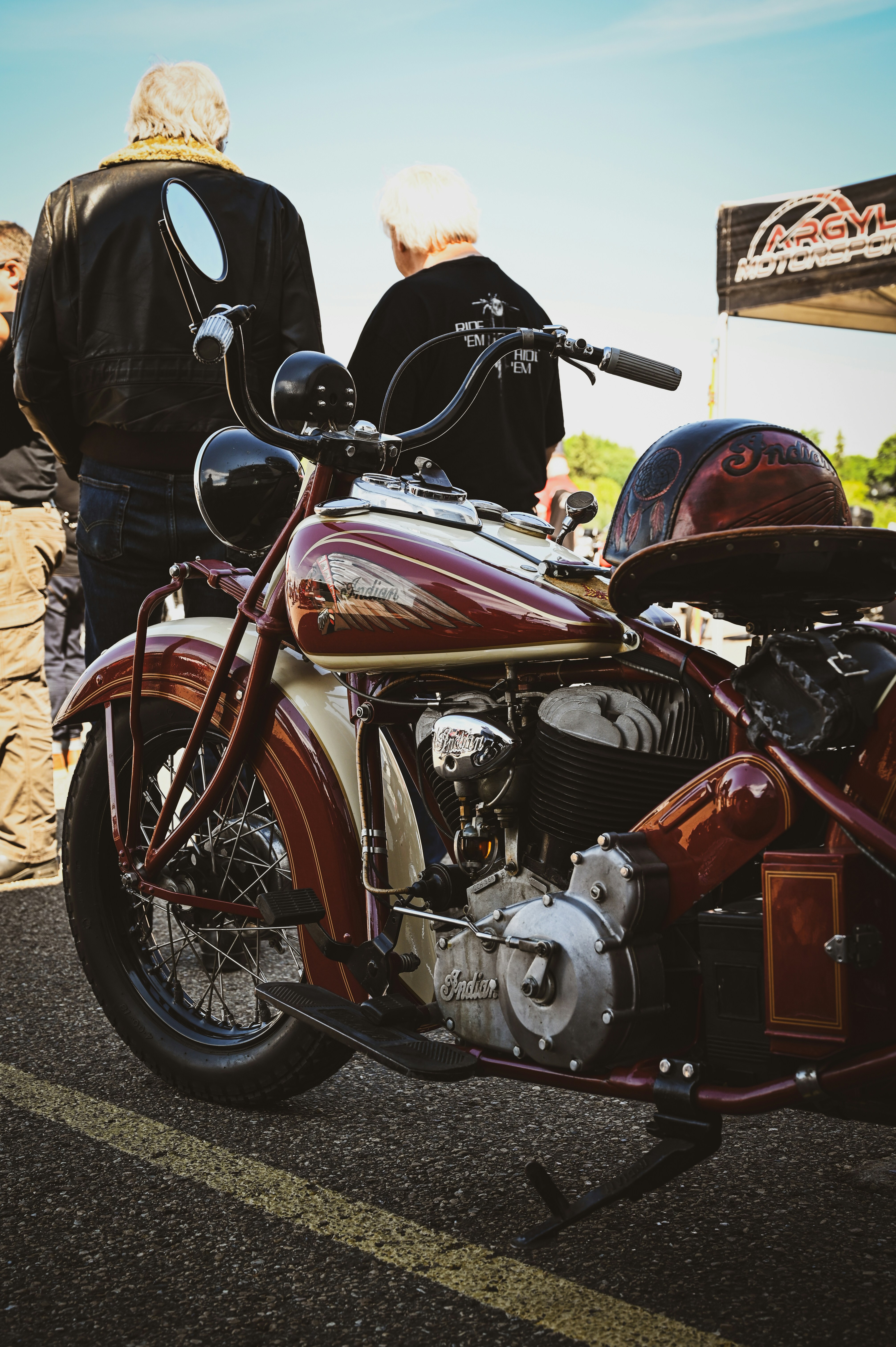 Chrome and Leather at Dusk: Vintage Bike, Modern Crowd