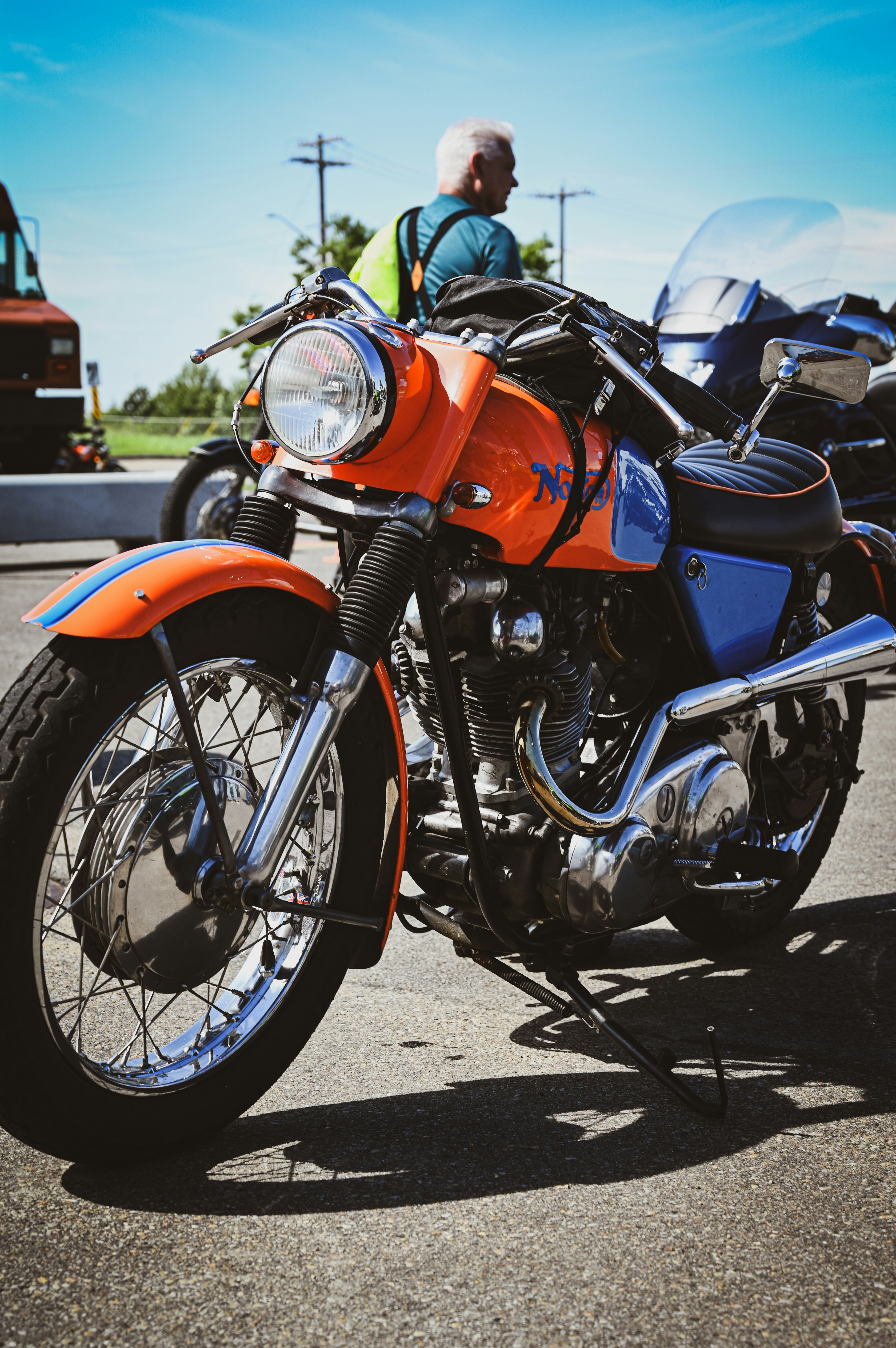 Orange Tiger: A Classic Moto Portrait Paused in the Lot