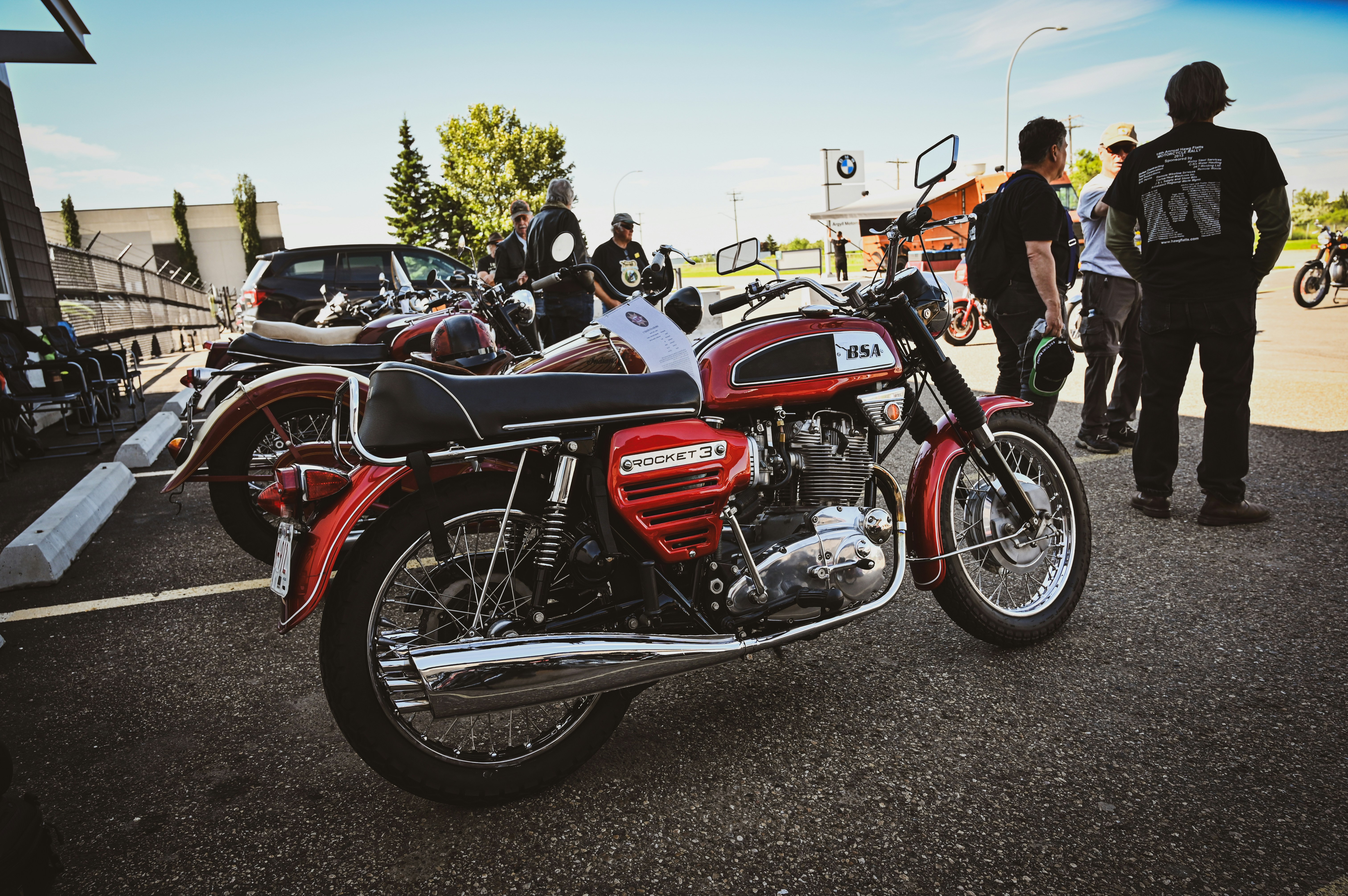 Red Classic: A vintage motorcycle under a sunlit pit area