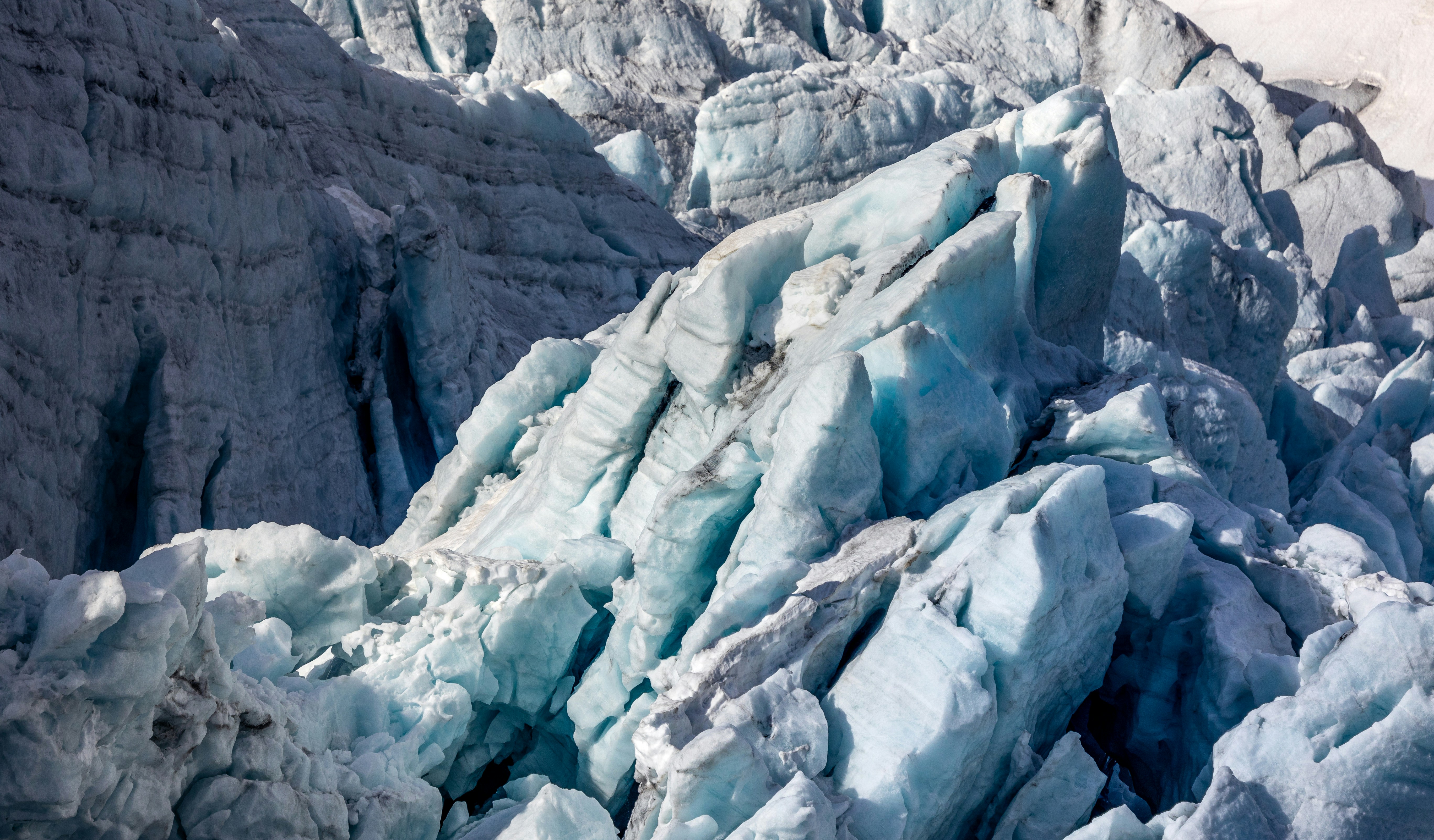 Blue Ice Cathedral: Gnarled Glacial Ridges Under Winter Light