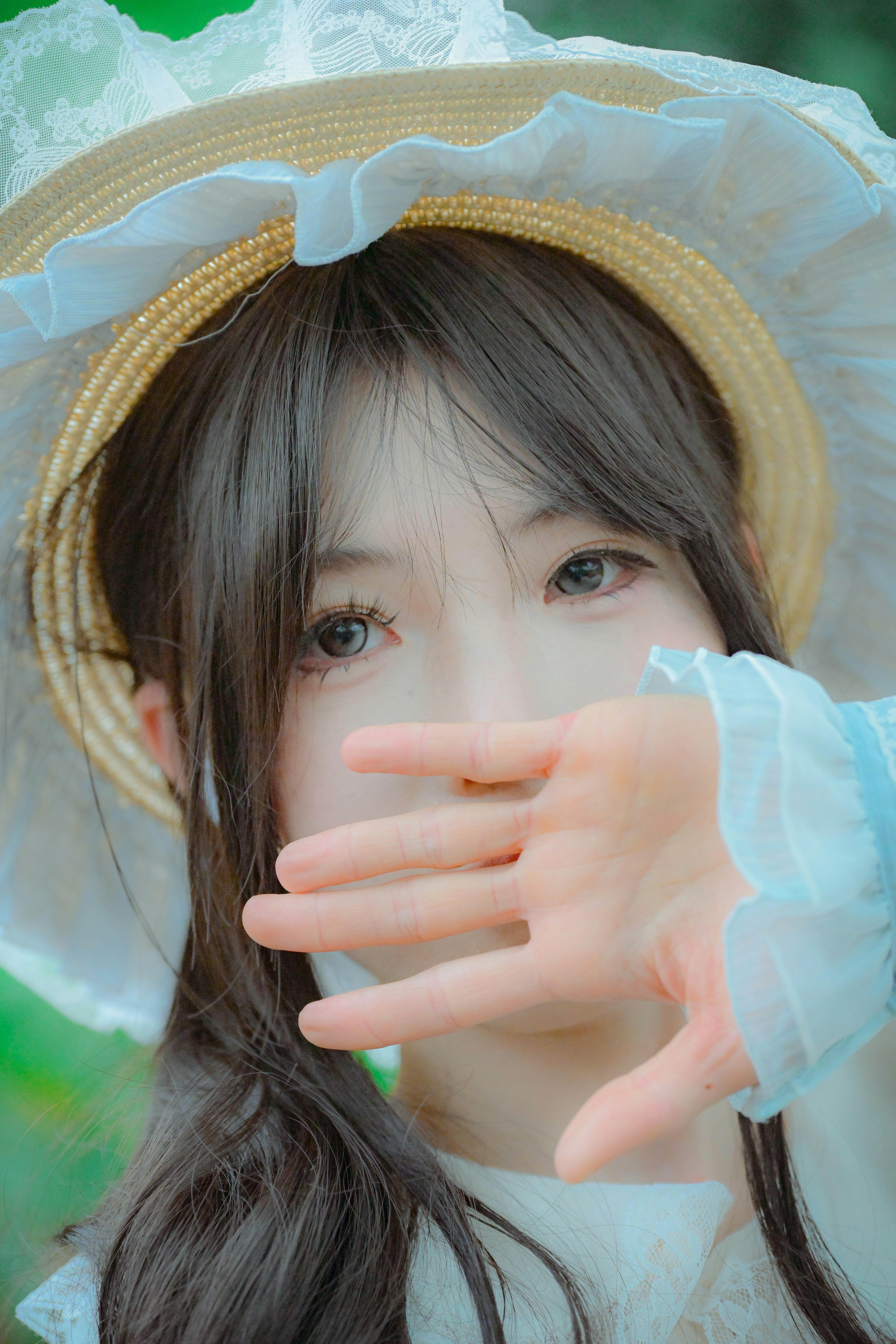 Gentle Gaze Behind a Painted Hand