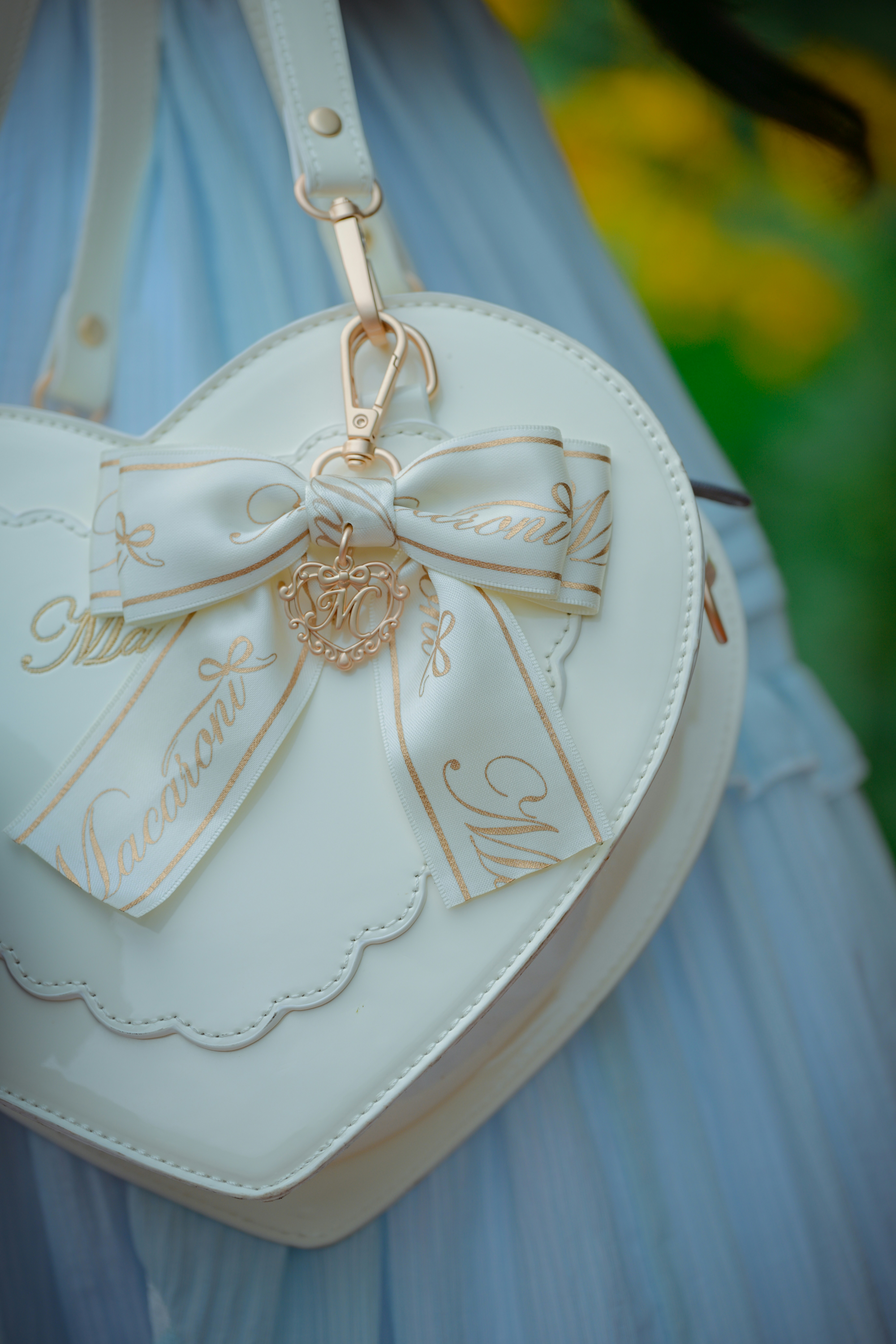 Heart-Shaped Confetti of Style: A Soft Moment with a Pale-Washed Pouch